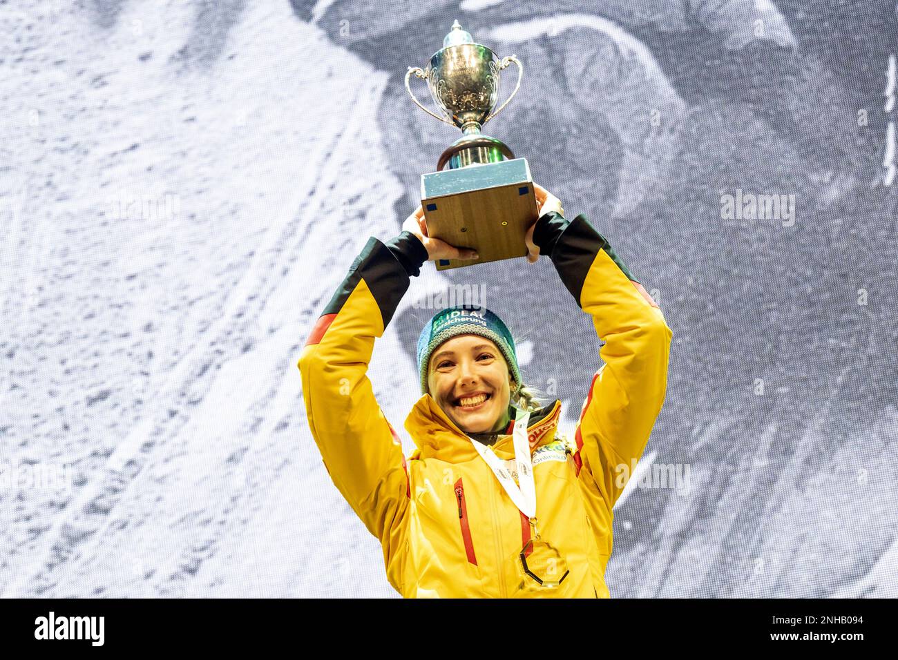 Winner Susanne Kreher of Germany stands on the podium with the trophy ...