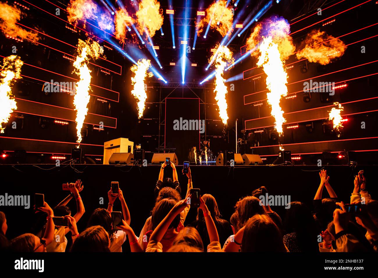 Empty concert stage with fires. Atmosphere of concert. Audience in ...