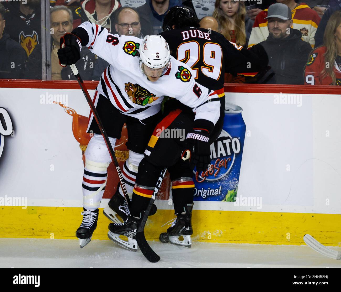 Chicago Blackhawks defenseman Jake McCabe, left, checks Calgary Flames ...