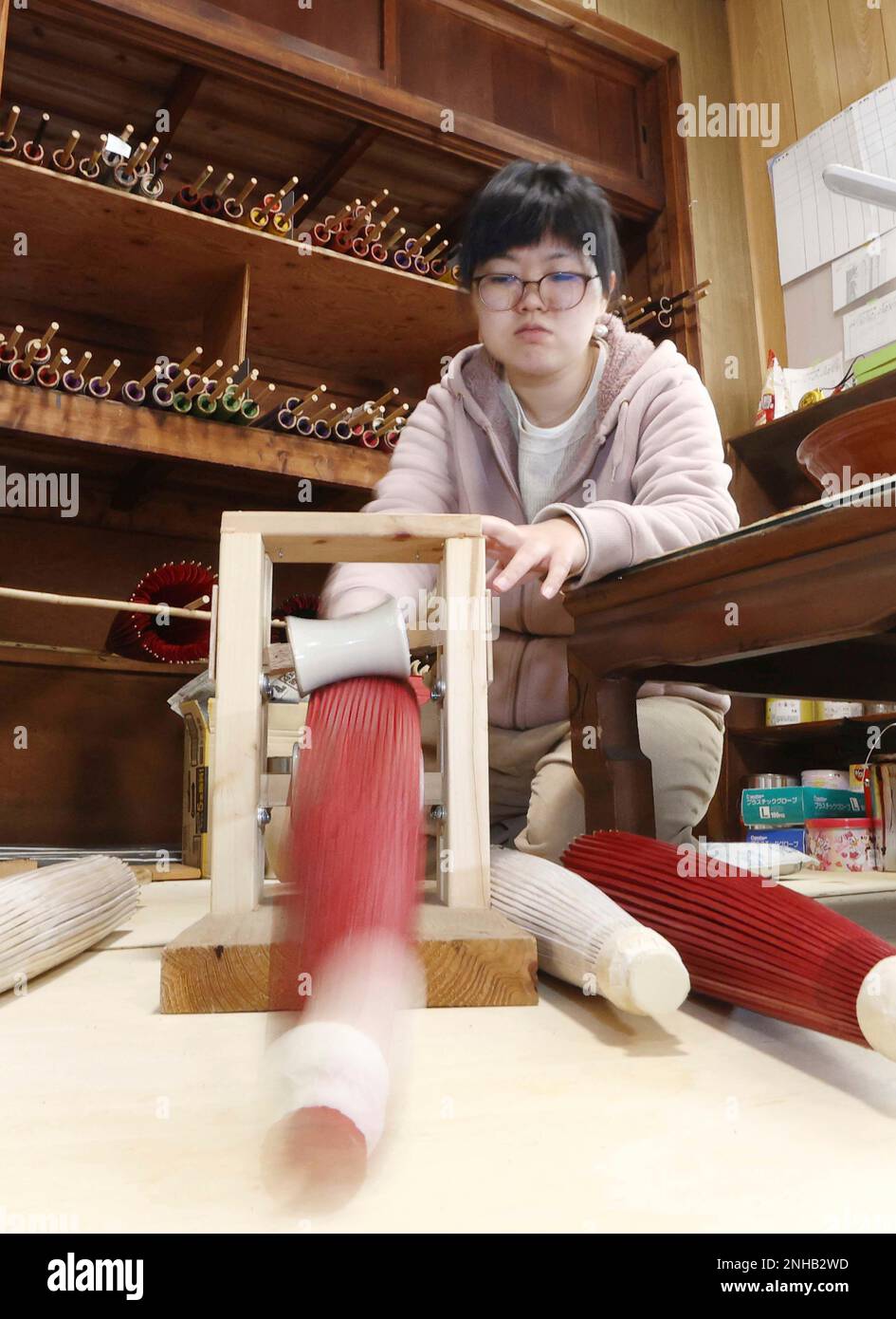 A craftsman makes Gifu Wagasa, special Japanese umbrellas of the city ...
