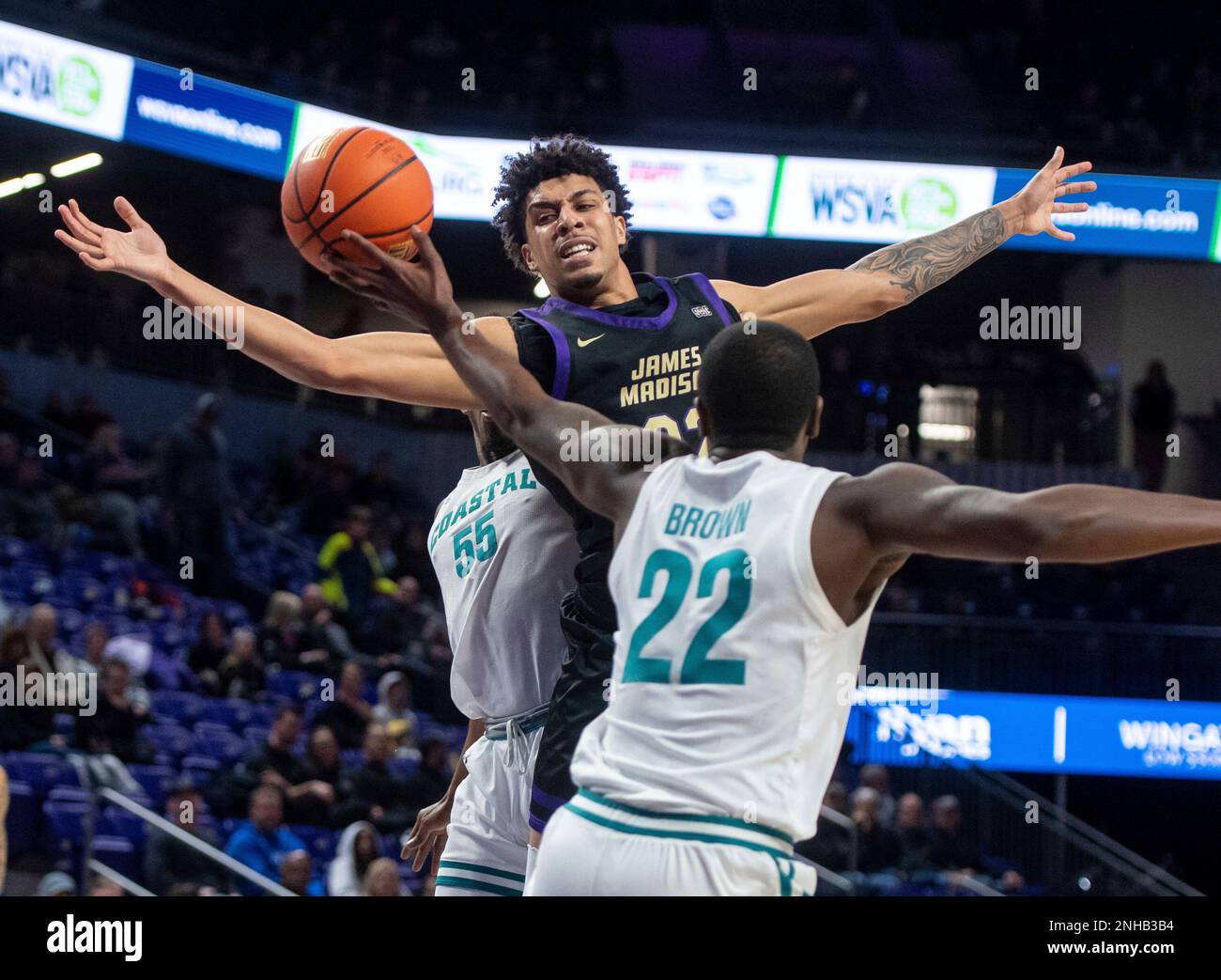 James Madison forward Julien Wooden loses control of the ball as he ...