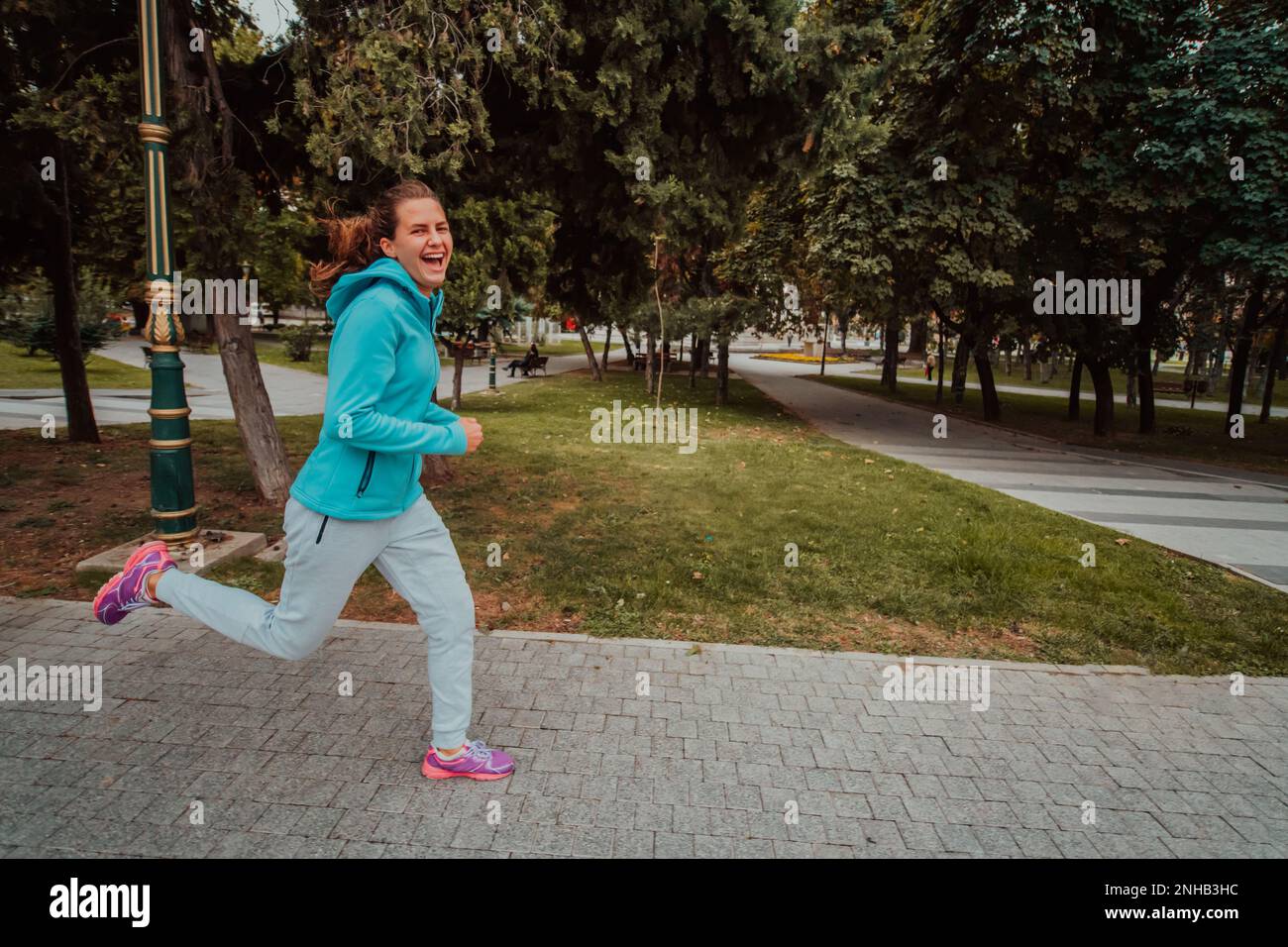 Women in sports clothes running in a modern urban environment. The ...