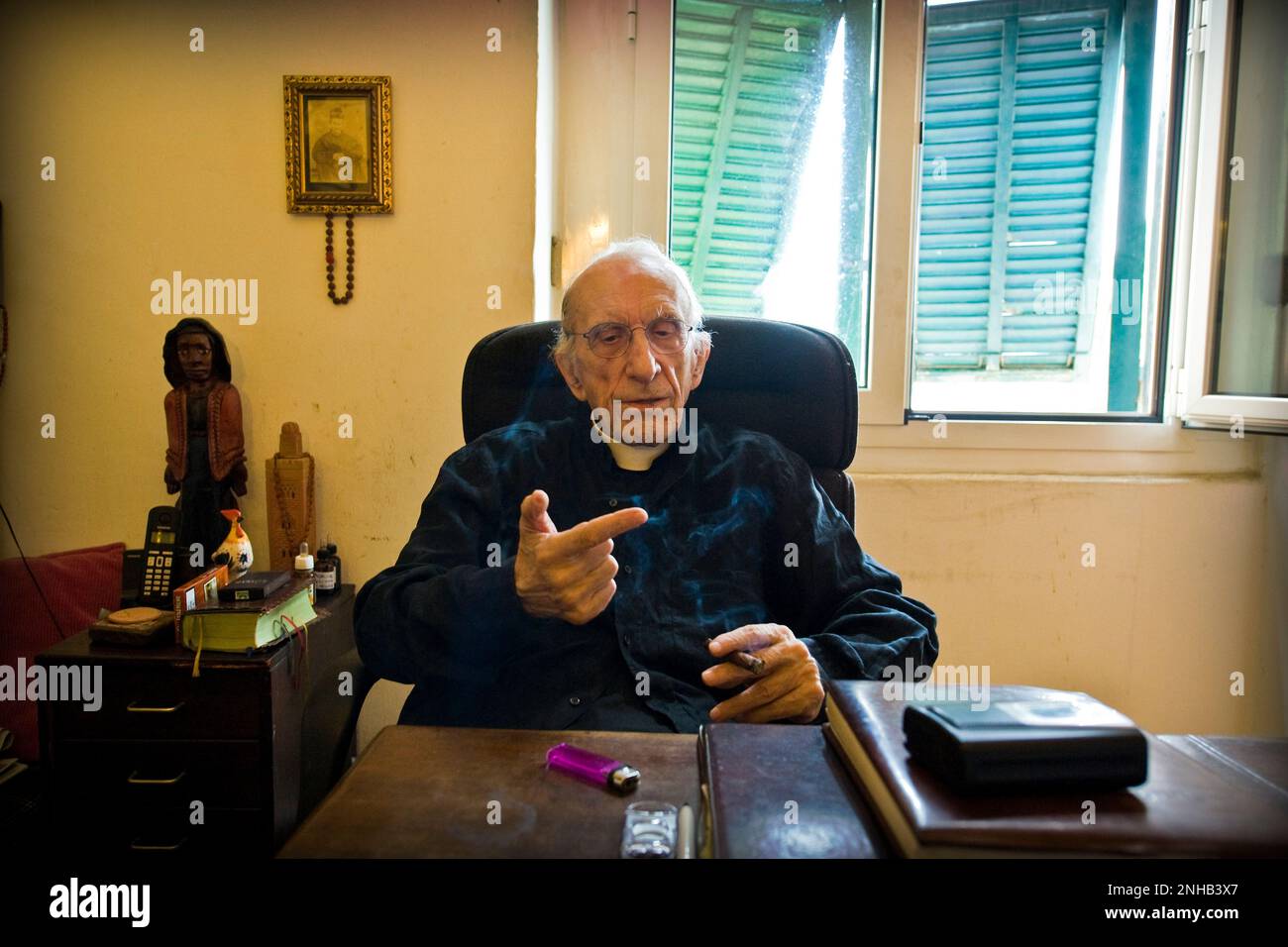 Don Andrea in her office during an interview. Don Andrea Gallo, Genoa ...