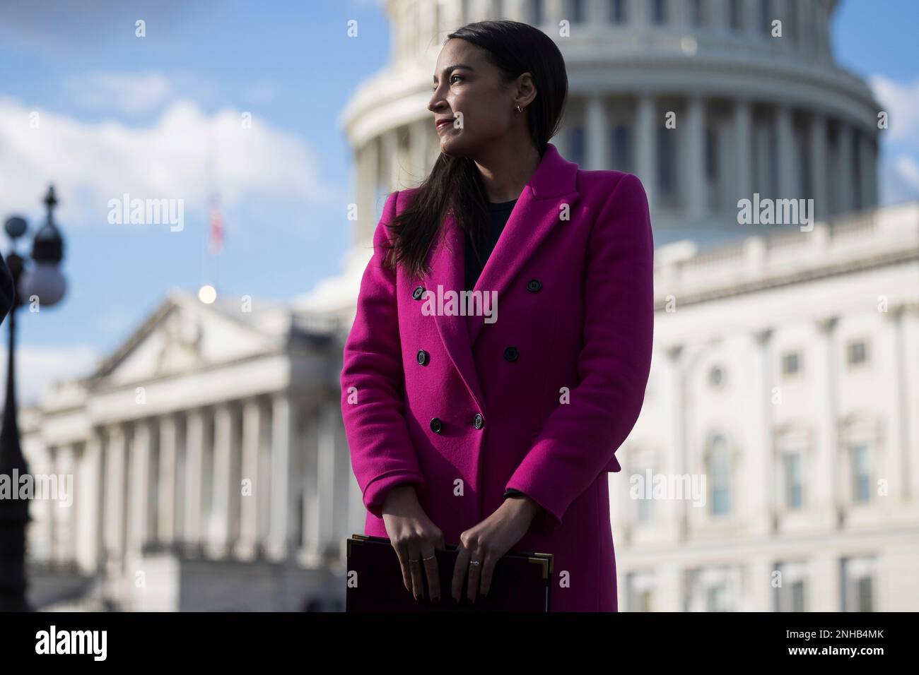 Rep. Alexandria Ocasio-Cortez (D-N.Y.) looks on during a press ...