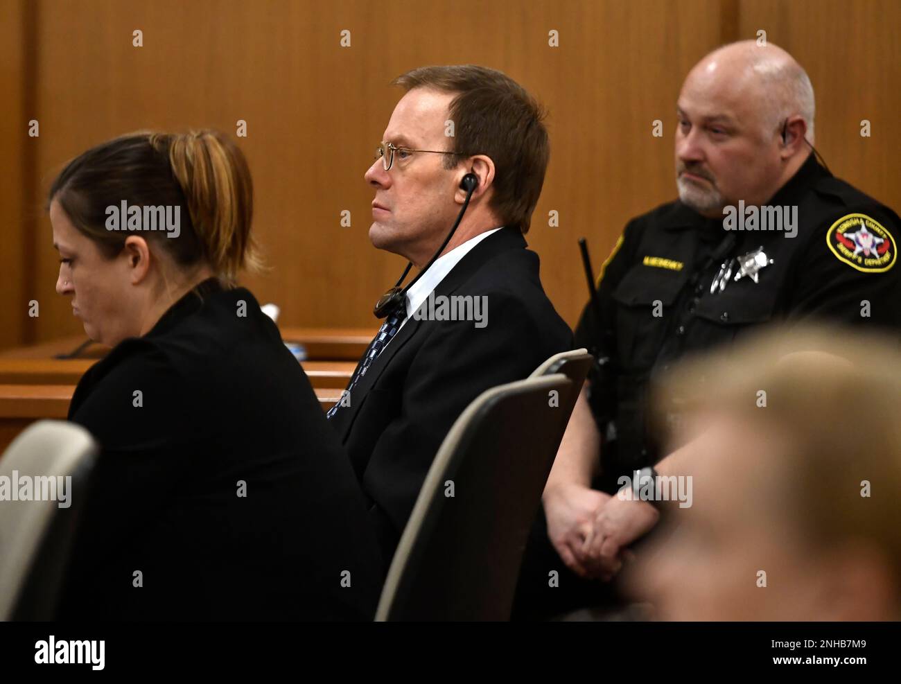 Mark Jensen, center, listens as Dr. Stacey Hail, a medical toxicologist ...