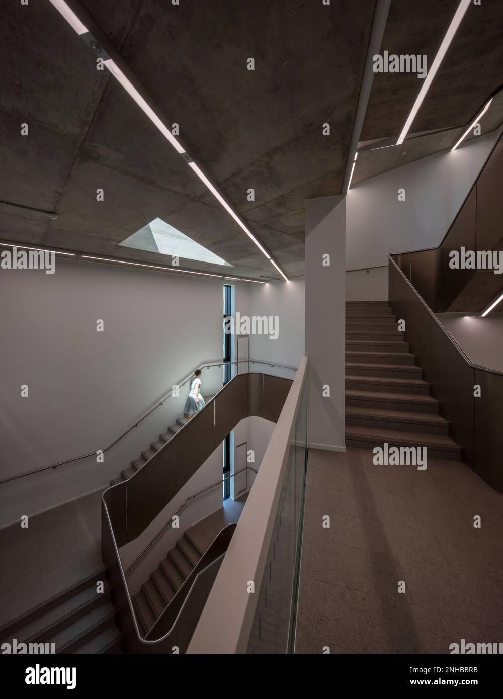 Wide angle shot of the Stair well volume, with someone walking up the ...