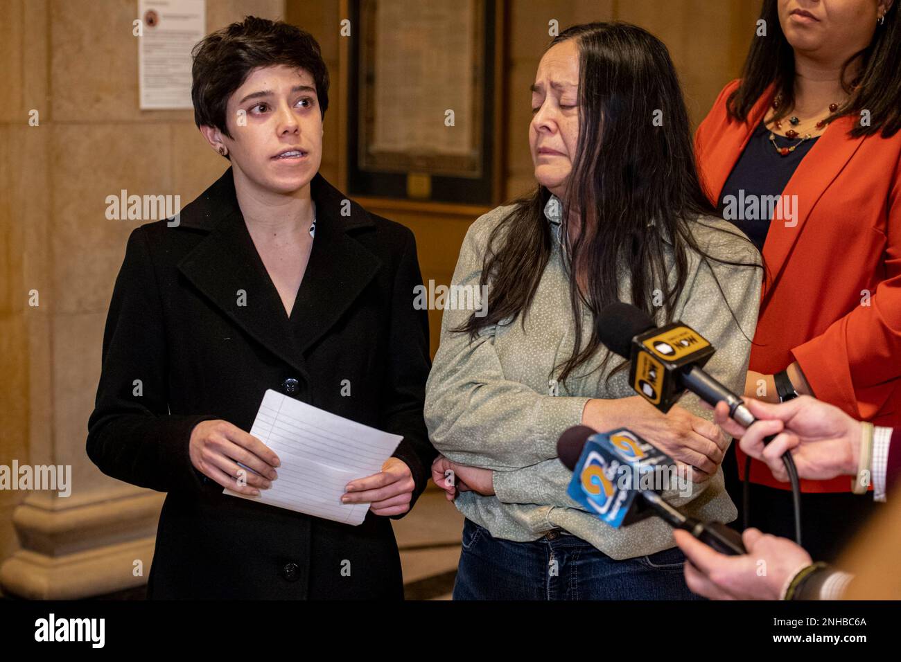 Danielle Jackson-Parsons, left, and Kay Jackson, right, read a ...