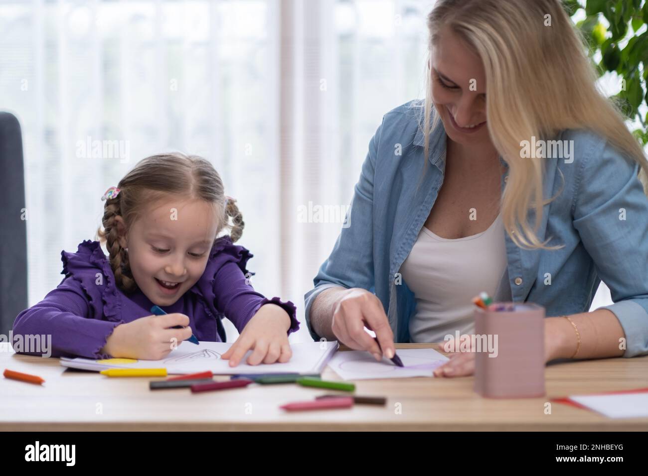 Teaching child art and drawing, mother teach little daughter to paint ...