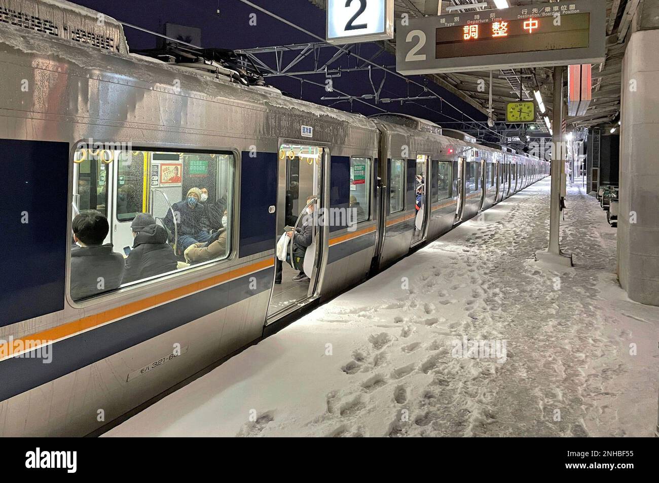 A train stops due to a power outage at Nishioji Station in Kyoto ...