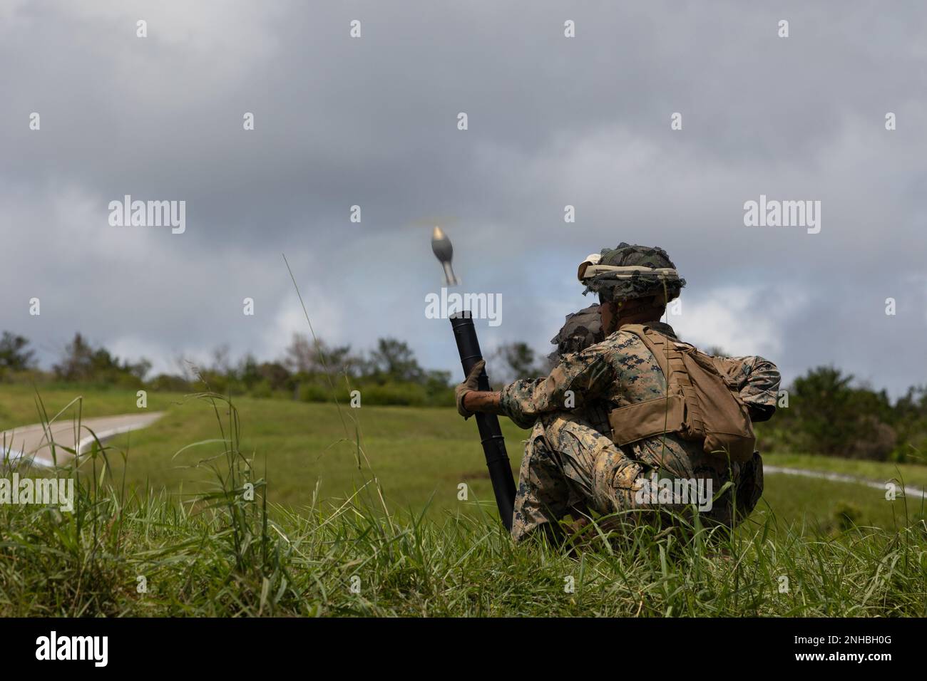 U.S. Marines with 3d Battalion, 3d Marines fire an M224 60 mm mortar system while conducting ...