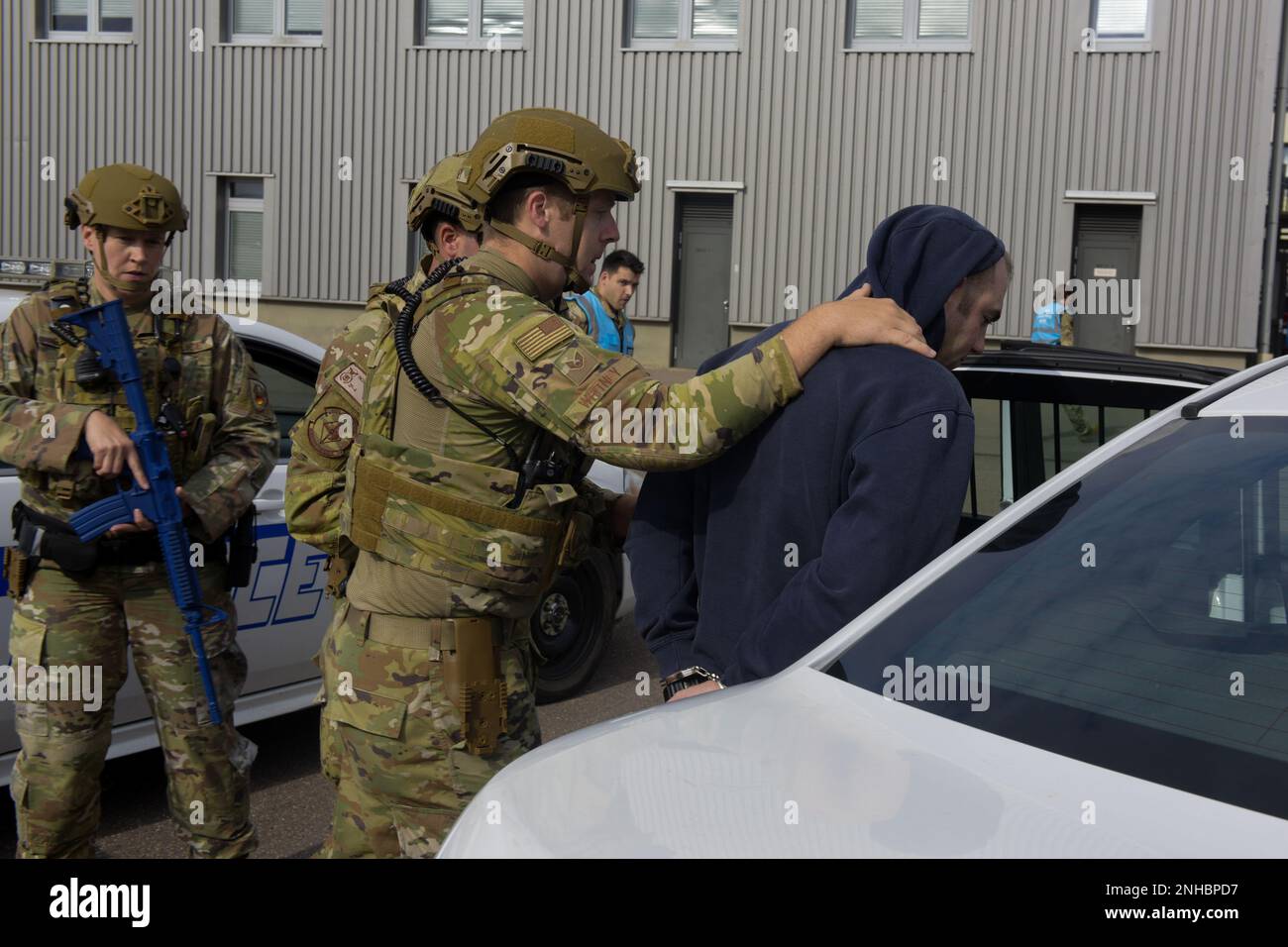 U.S Air Force Airmen assigned to the 86th Security Forces Squadron apprehend a suspect during an ...