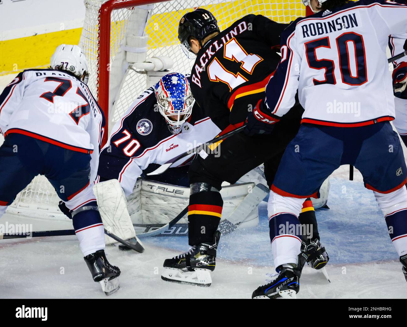 Columbus Blue Jackets goalie Joonas Korpisalo (70) tries to cover the ...