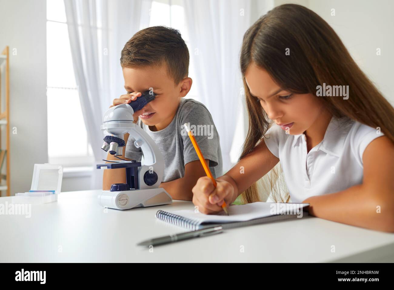 Child under desk at school hi-res stock photography and images - Alamy