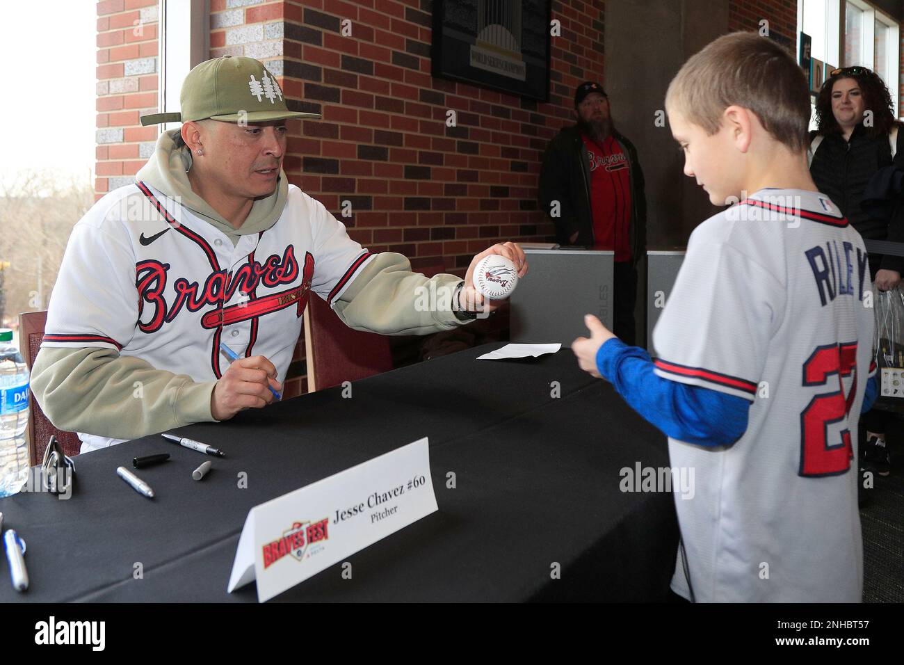 ATLANTA, GA - JANUARY 21: Braves pitcher Jesse Chavez autographs a ...