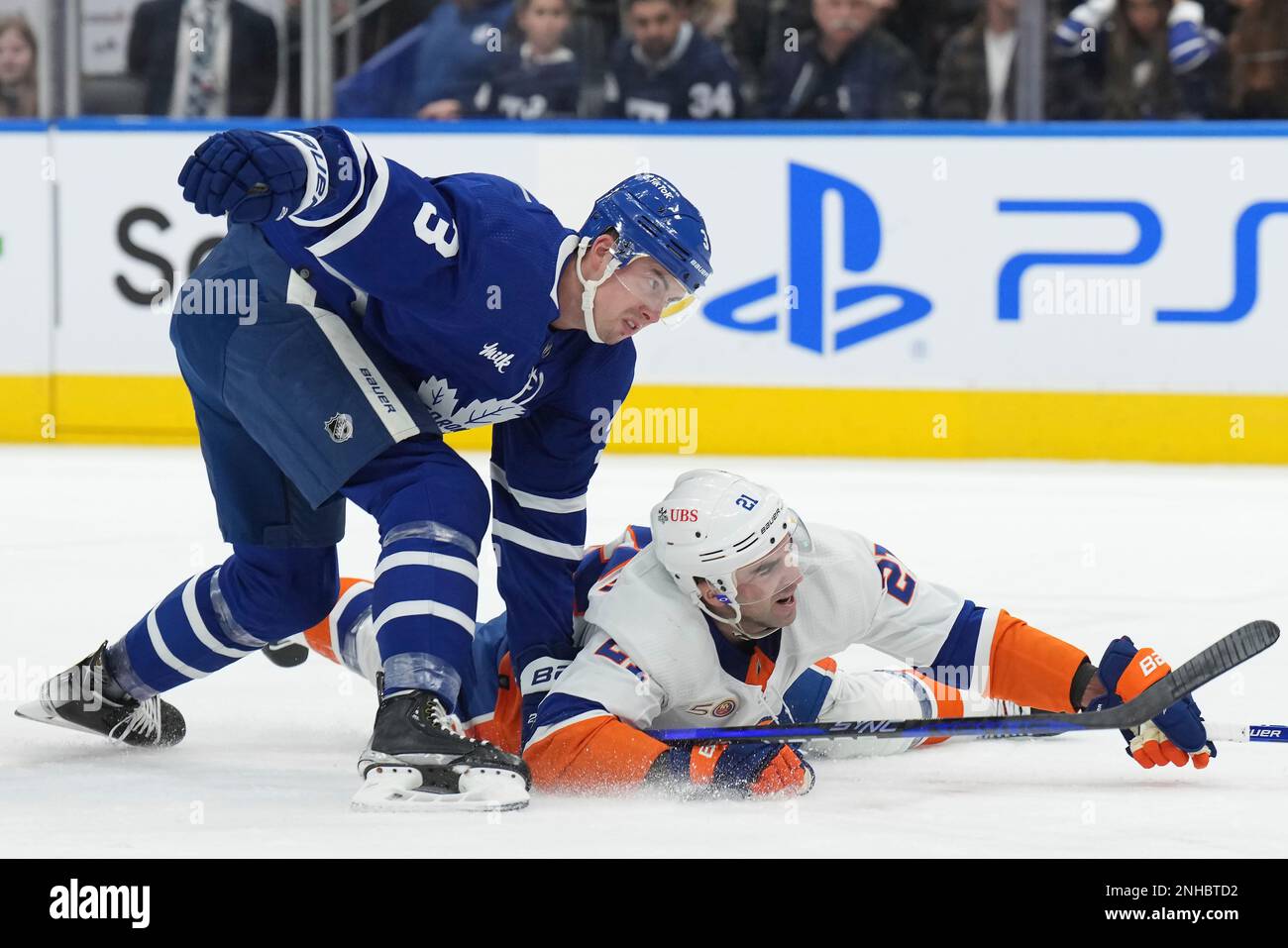 Toronto Maple Leafs defenseman Justin Holl (3) knocks New York ...
