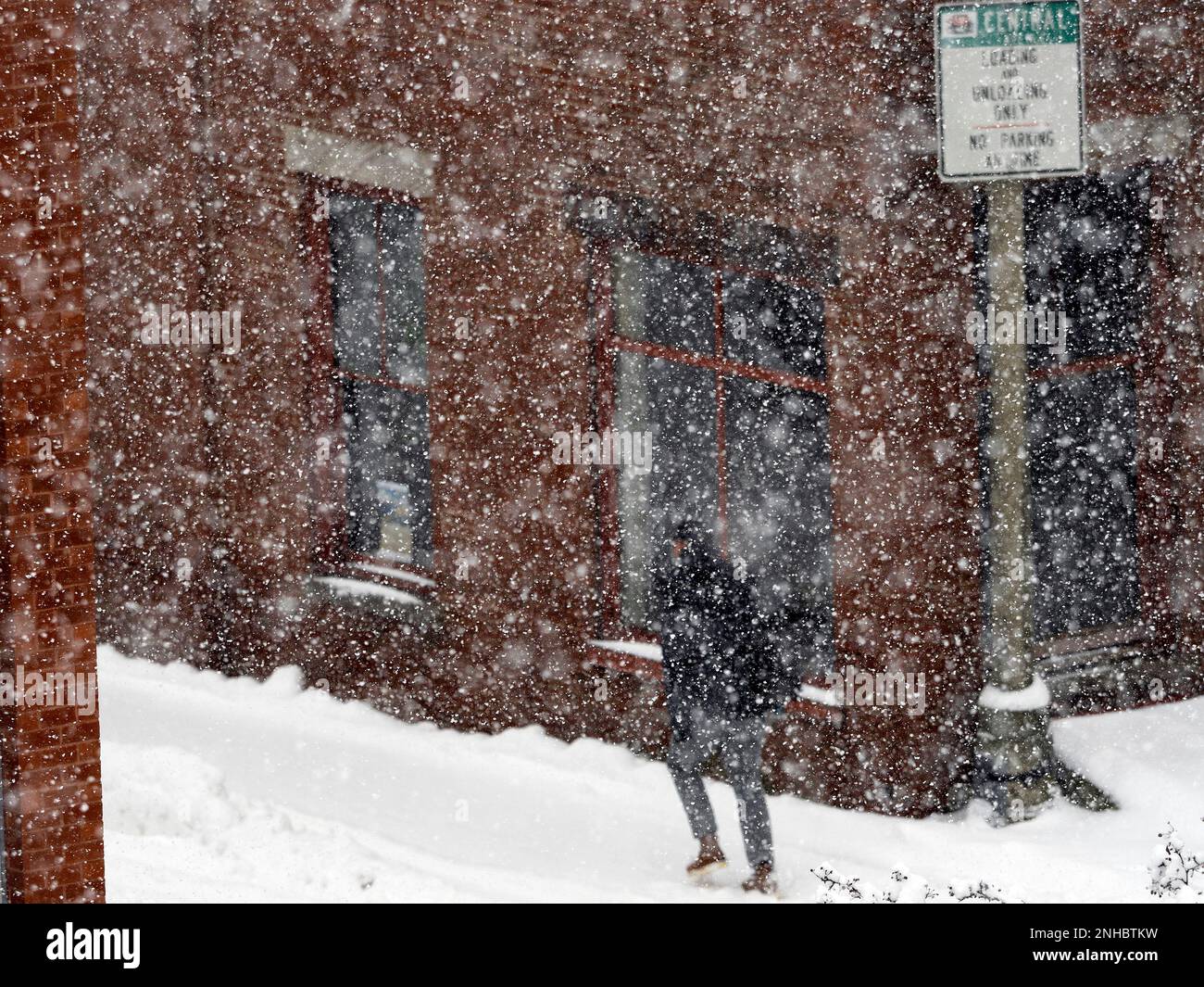 A pedestrian walks on Warren Street in downtown Concord, N.H., during a ...