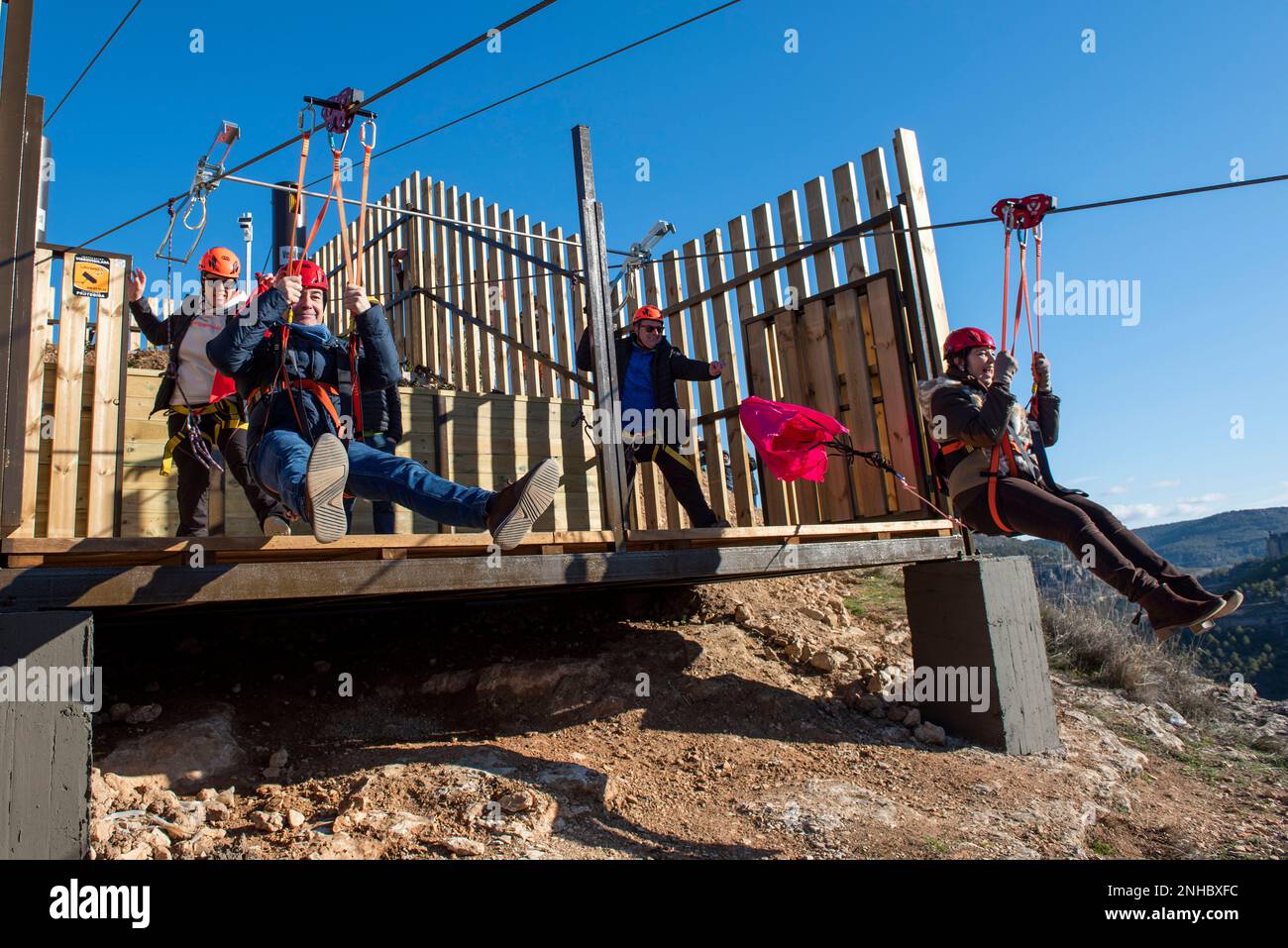 Two people riding the Tirolina de las Hoces on the day of its ...