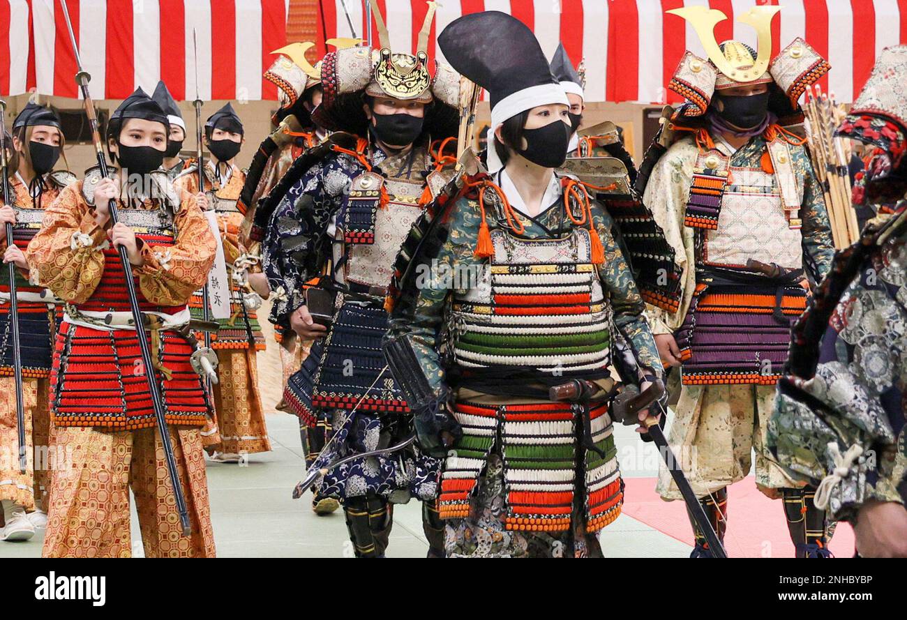 Participants clad in samurai armor march during an annual New Year's ...