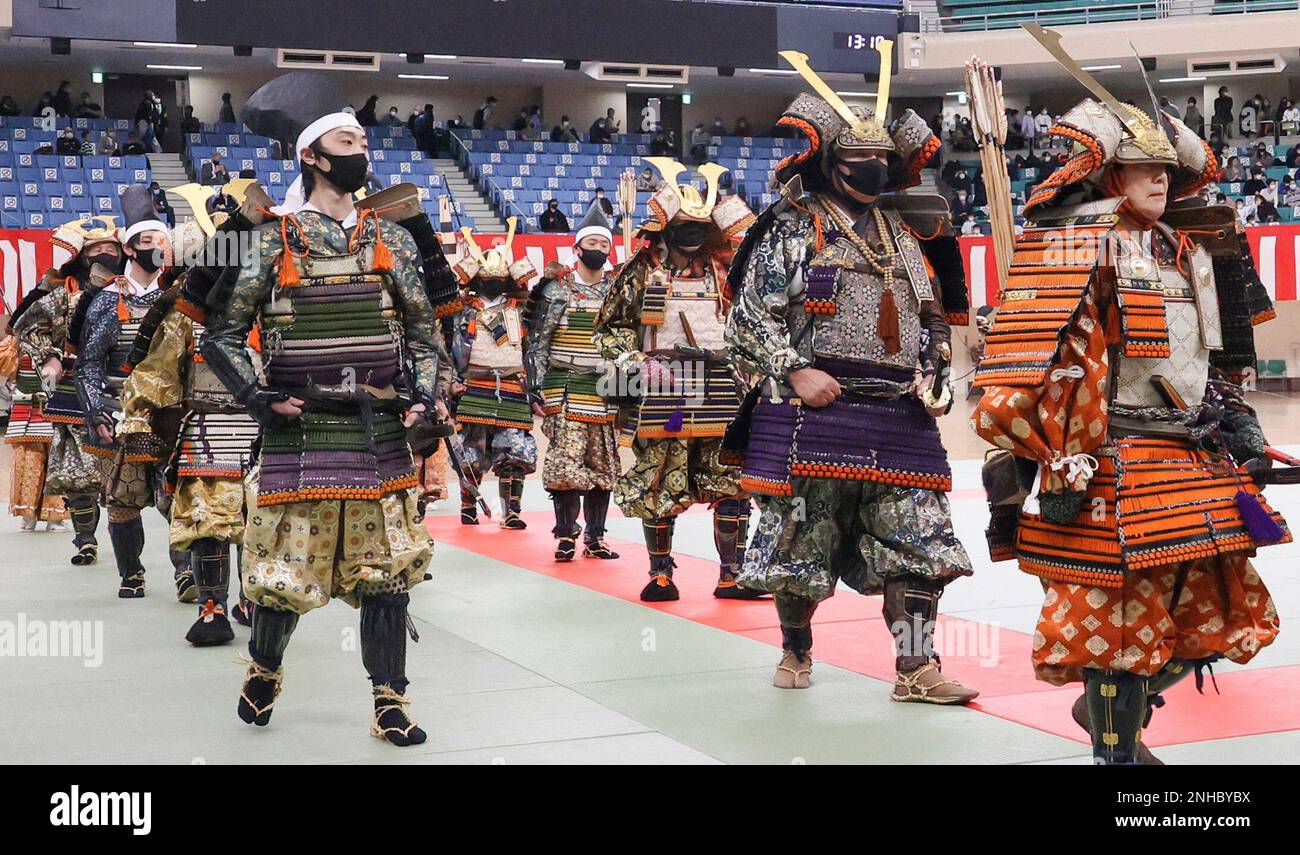 Participants clad in samurai armor march during an annual New Year's ...