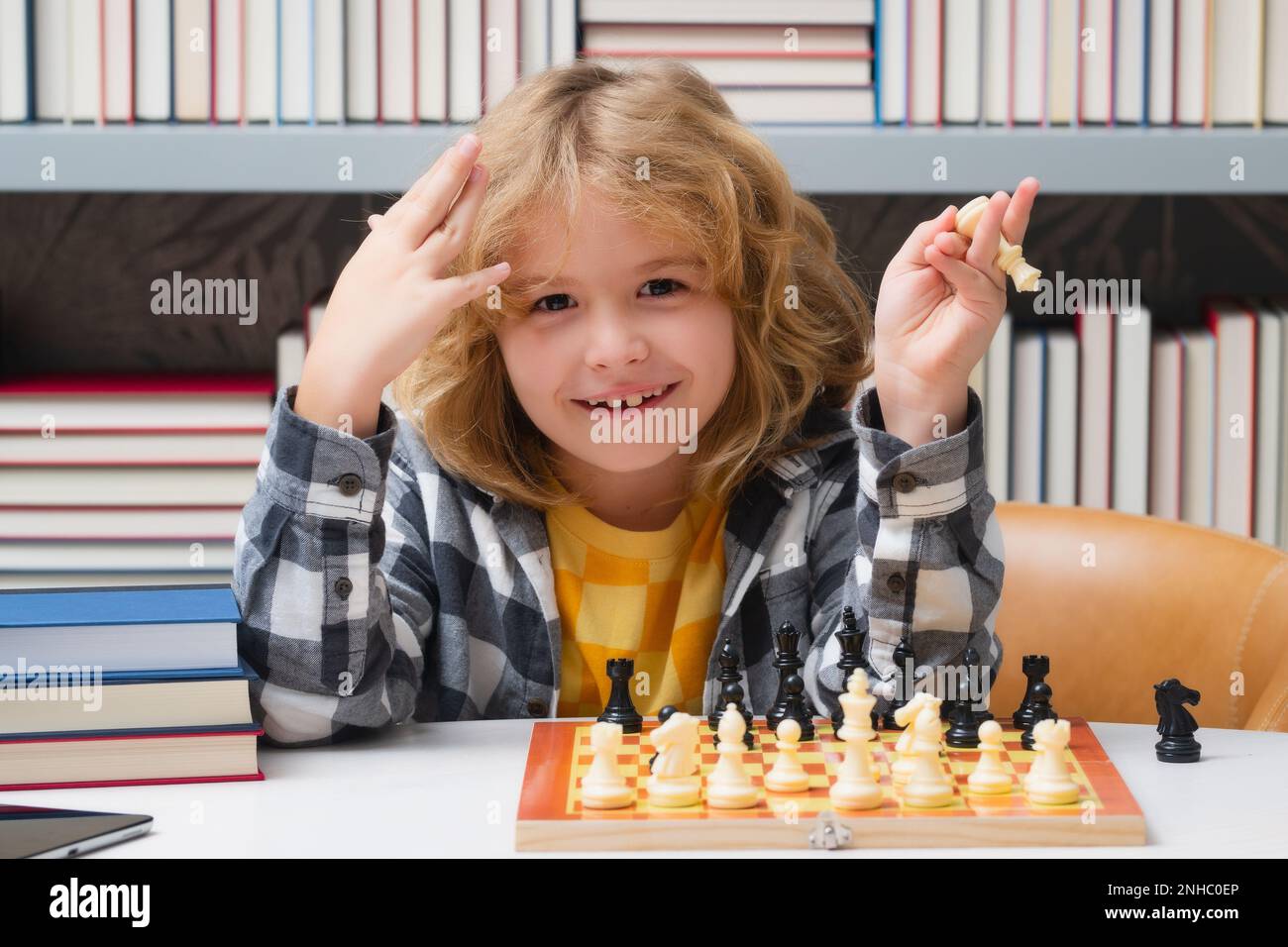 Chess school. Chess for intelligent kid. Child genius, smart pupil playing logic board game ...