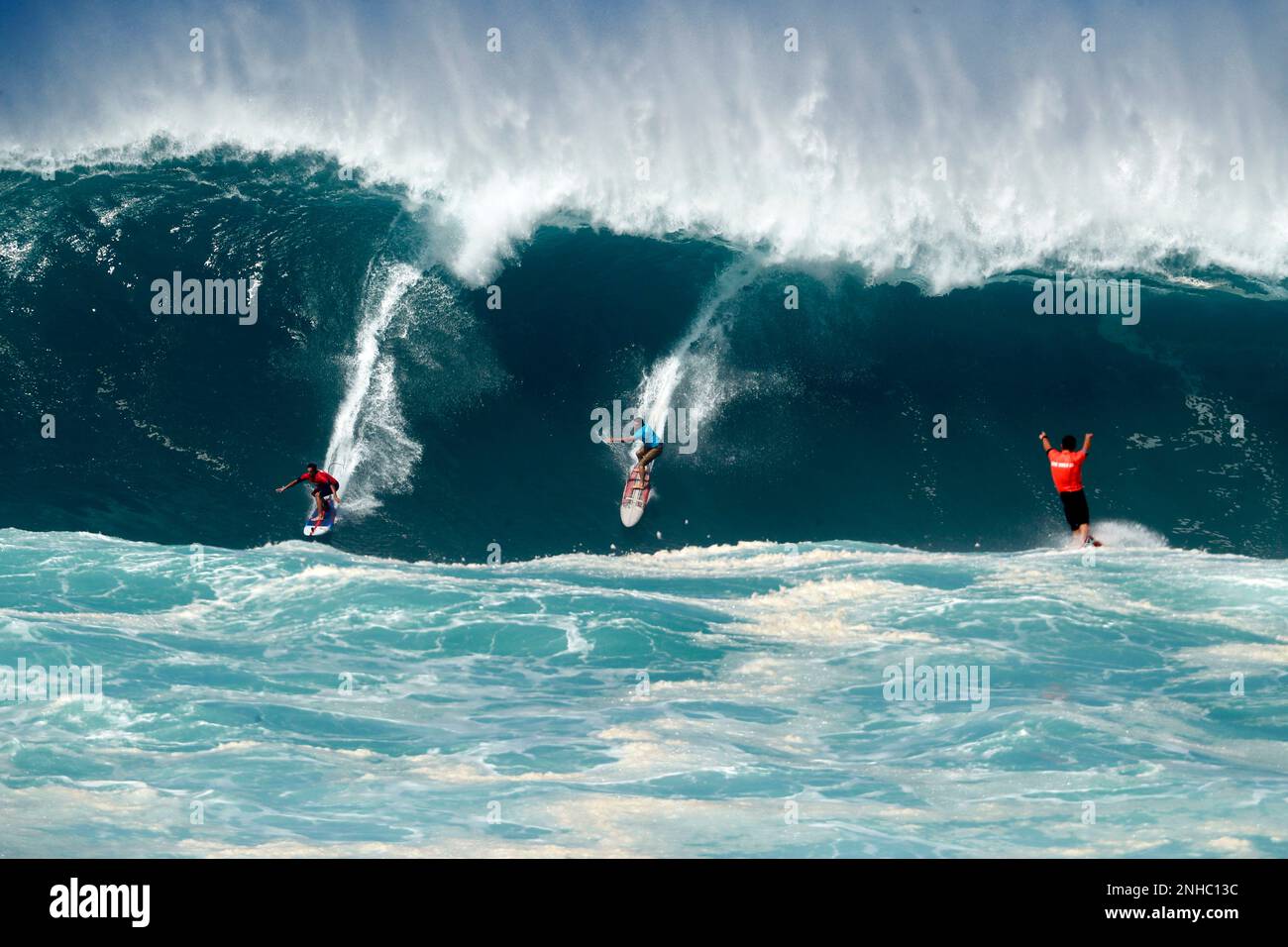 Kai Lenny, left, and Aaron Gold, center, are cheered on by Jake Maki ...