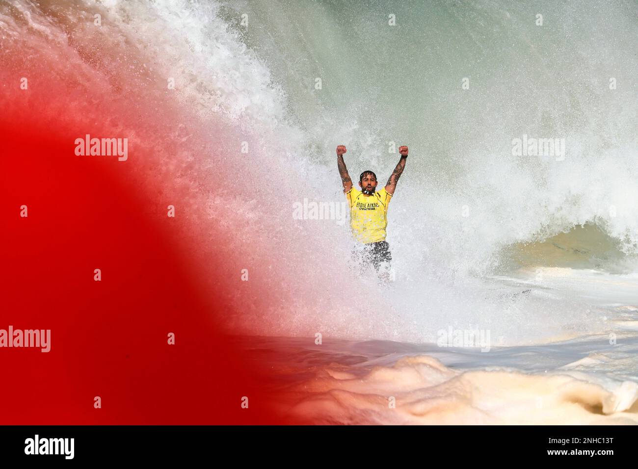 Billy Kemper throws up his arms up after completing his ride in Hawaii ...