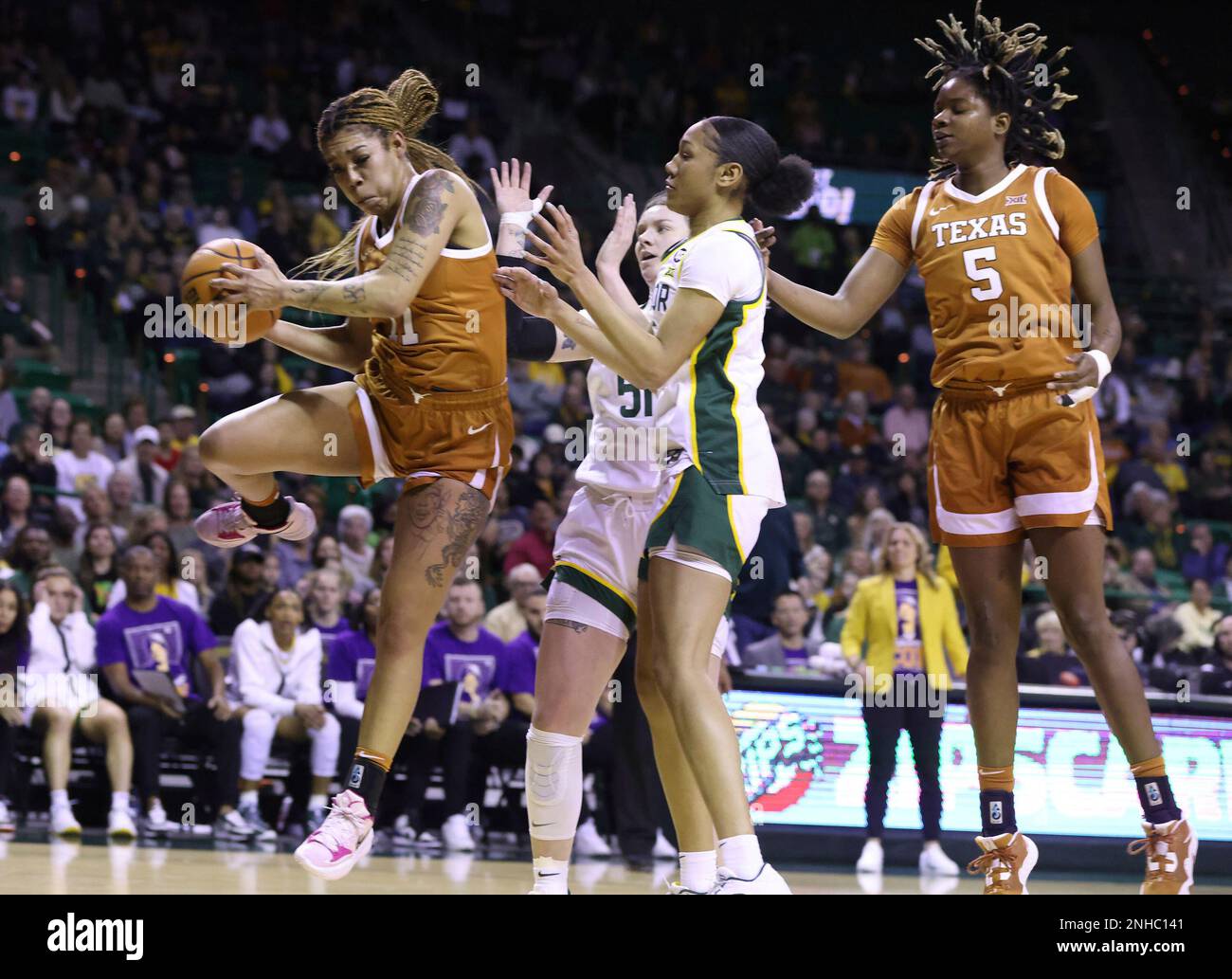 Texas guard Sonya Morris, left, pulls down a rebound over Baylor guard ...