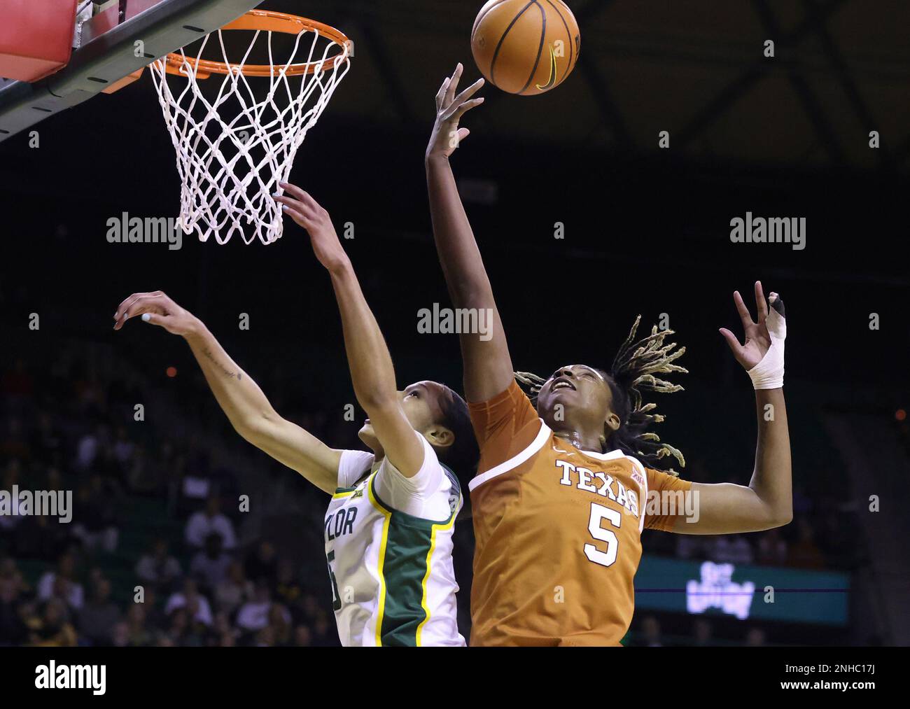 Texas forward DeYona Gaston, right, reaches for a rebound with Baylor ...