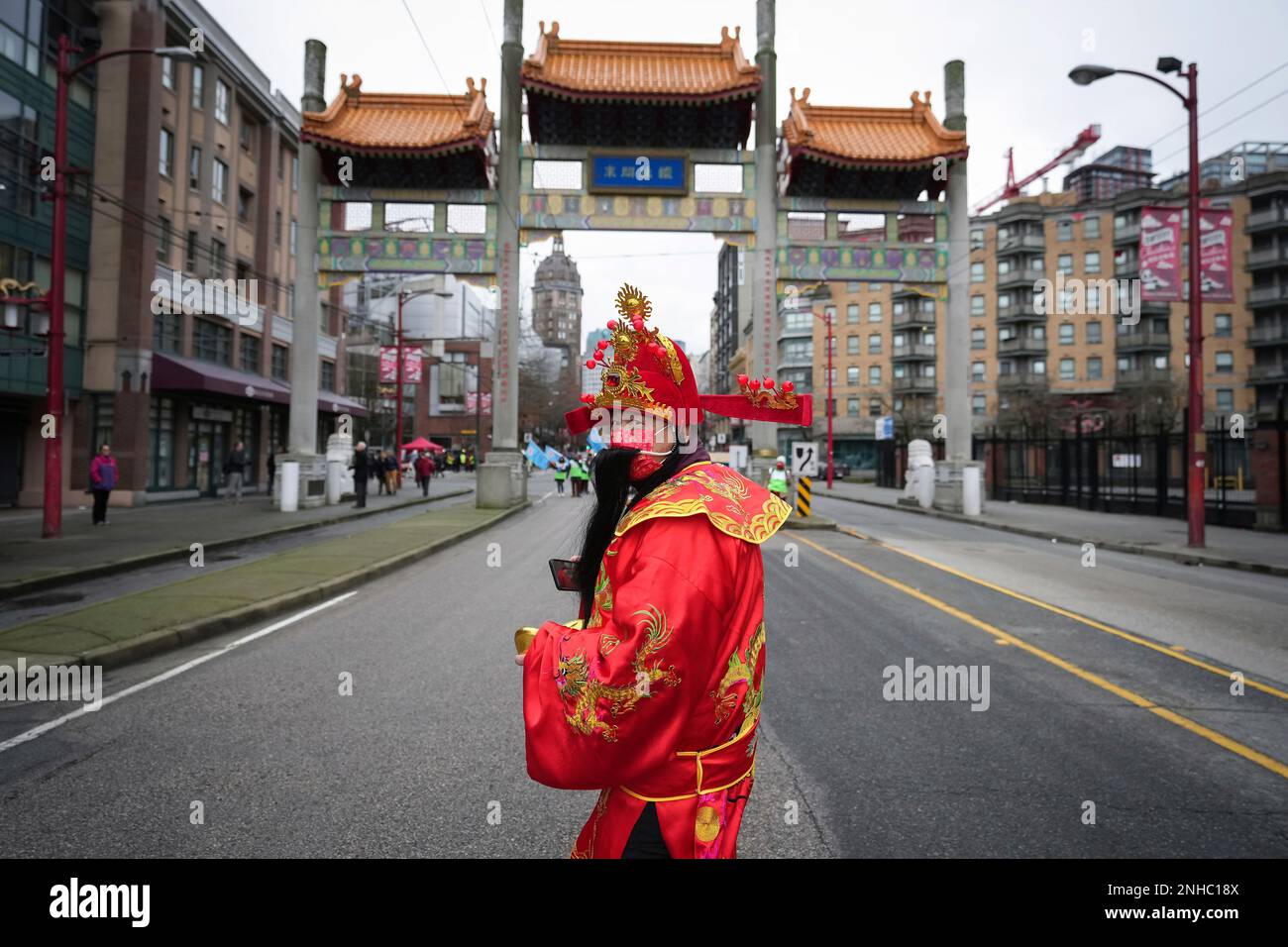 Terry Liu, dressed as the God of Wealth, prepares for the Lunar New ...