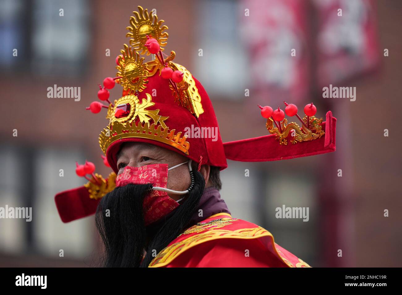 Terry Liu, dressed as the God of Wealth, prepares to march in the Lunar ...