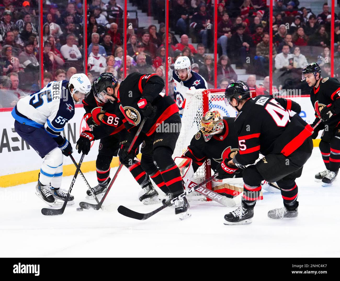 Ottawa Senators' Travis Hamonic (23) and Jake Sanderson (85) fight ...
