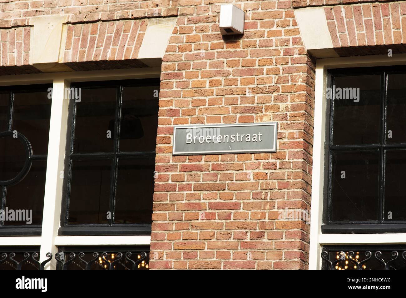 Blue street name sign of Broerenstraat on a brick stone wall in Arnhem ...