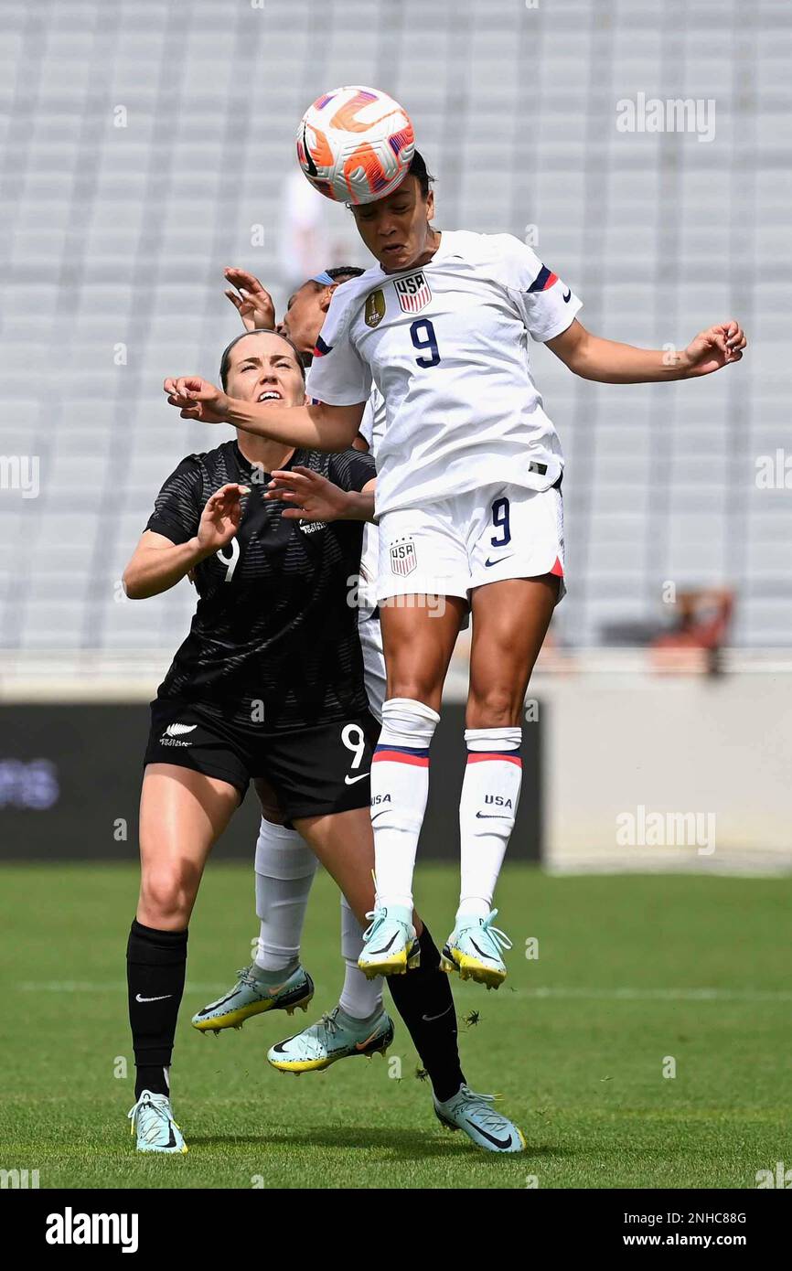 Mallory Swanson of the U.S., right, heads the ball over New Zealand's ...