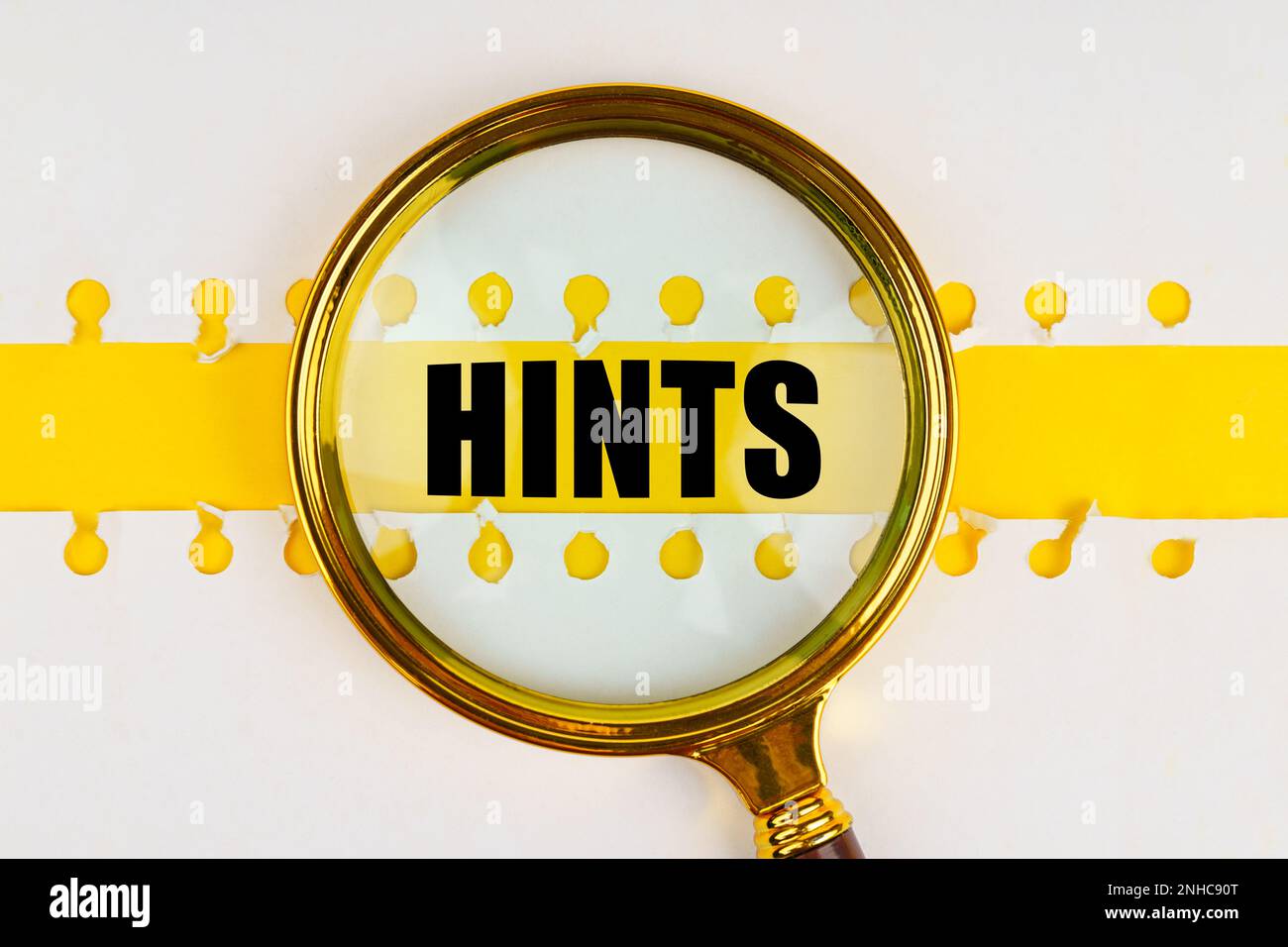 Between two sheets from a notebook on a yellow strip with the ...