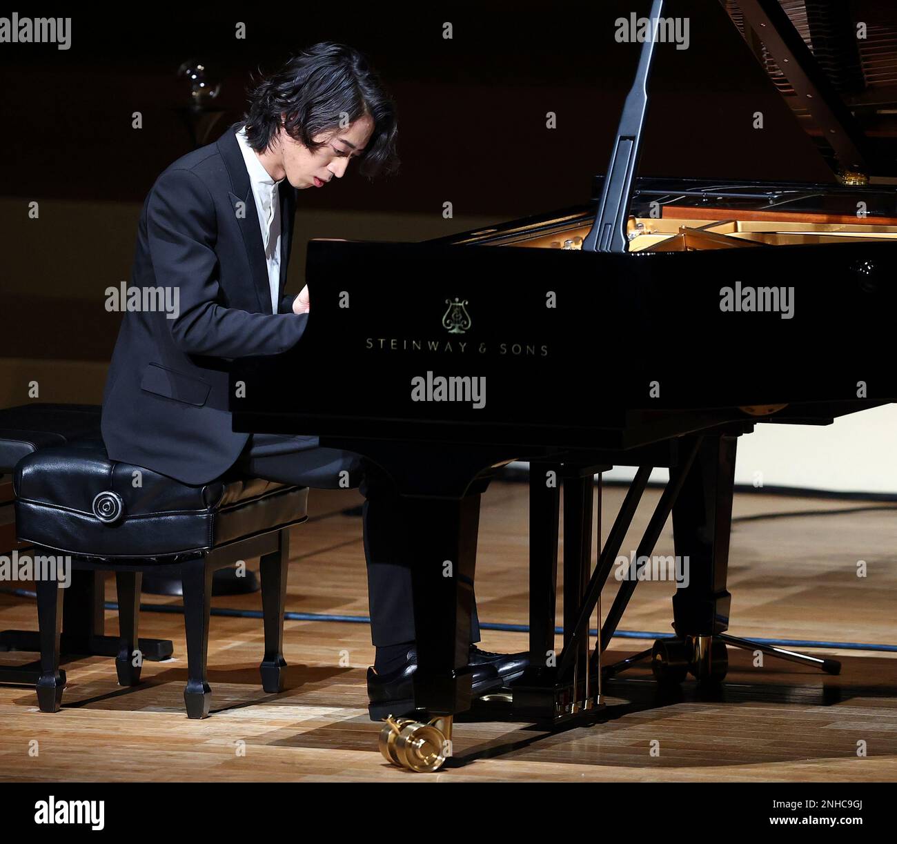 Japanese pianist Hayato Sumino plays piano during a concert in Sendai ...