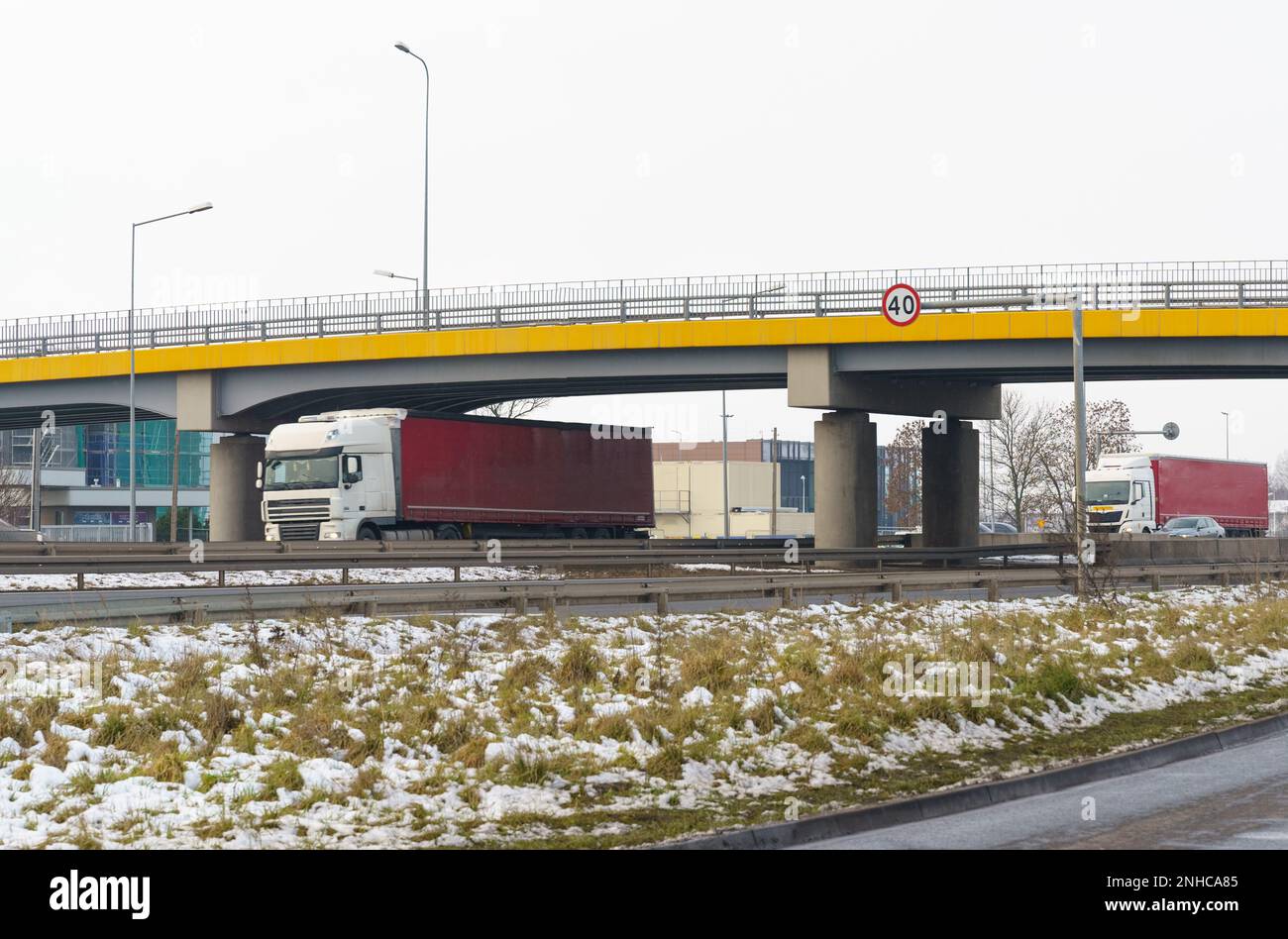 Trucks drive under the transport bridge. Transport logistics Stock ...