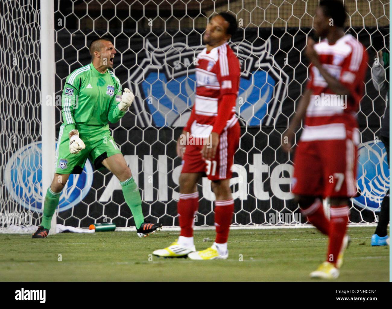 Earthquakes' goalkeeper, Jon Busch, celebrates a Dallas penalty kick ...