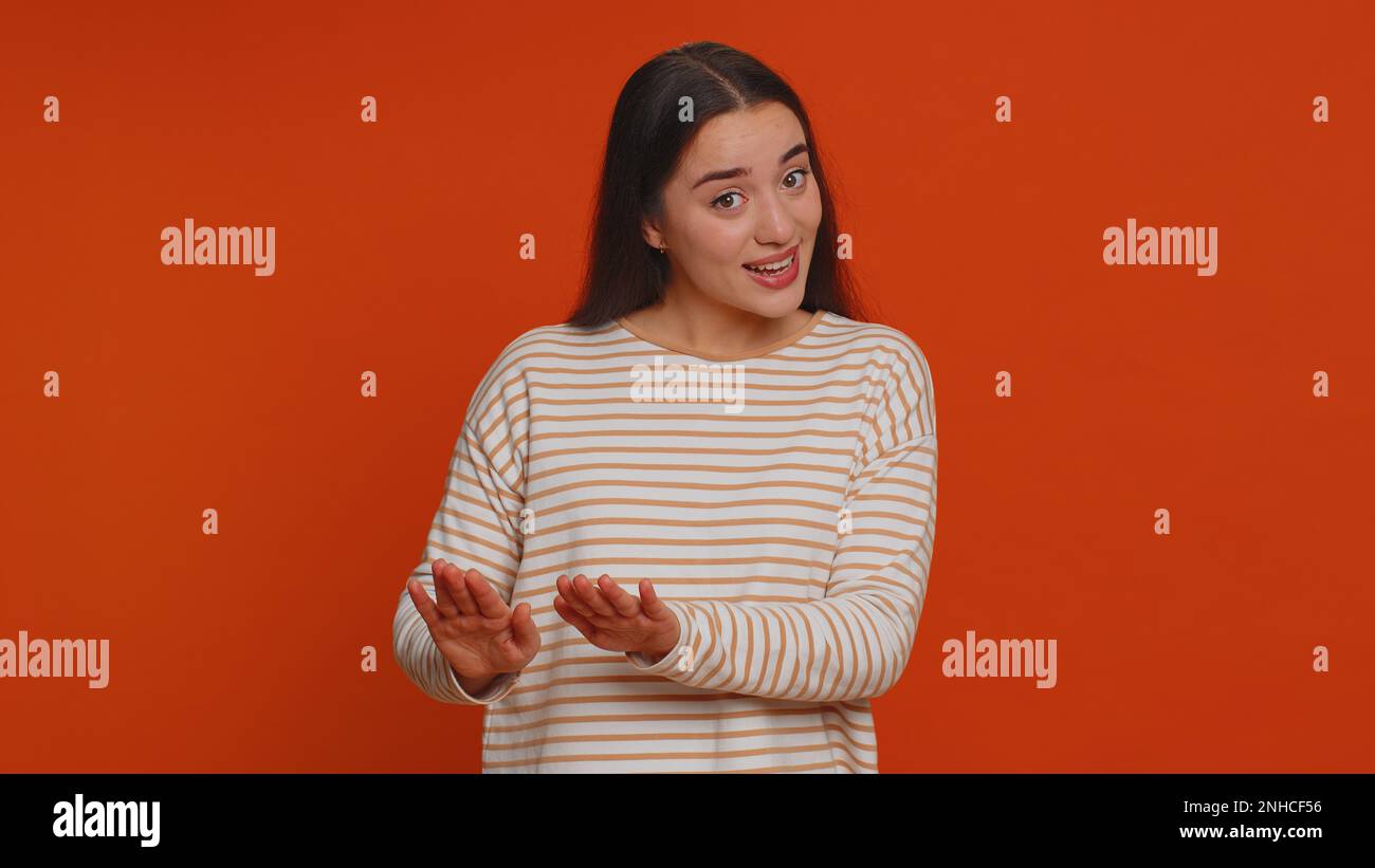 Hey you, be careful. Young woman warning with admonishing finger ...