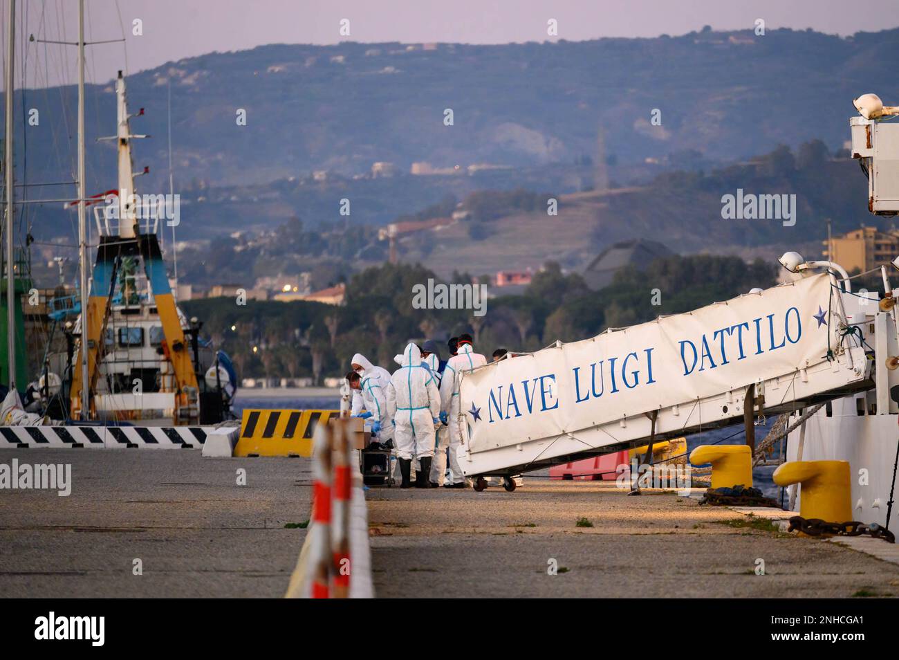 Members of the sanitary team seen near the footbridge. The Italian ...