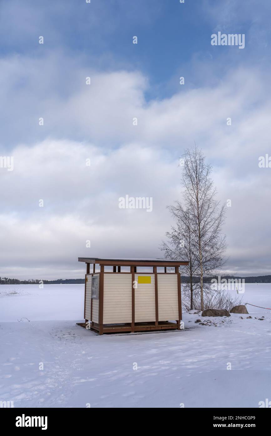 Wooden changing room cabin at the Finnish beach in winter. Hollola ...