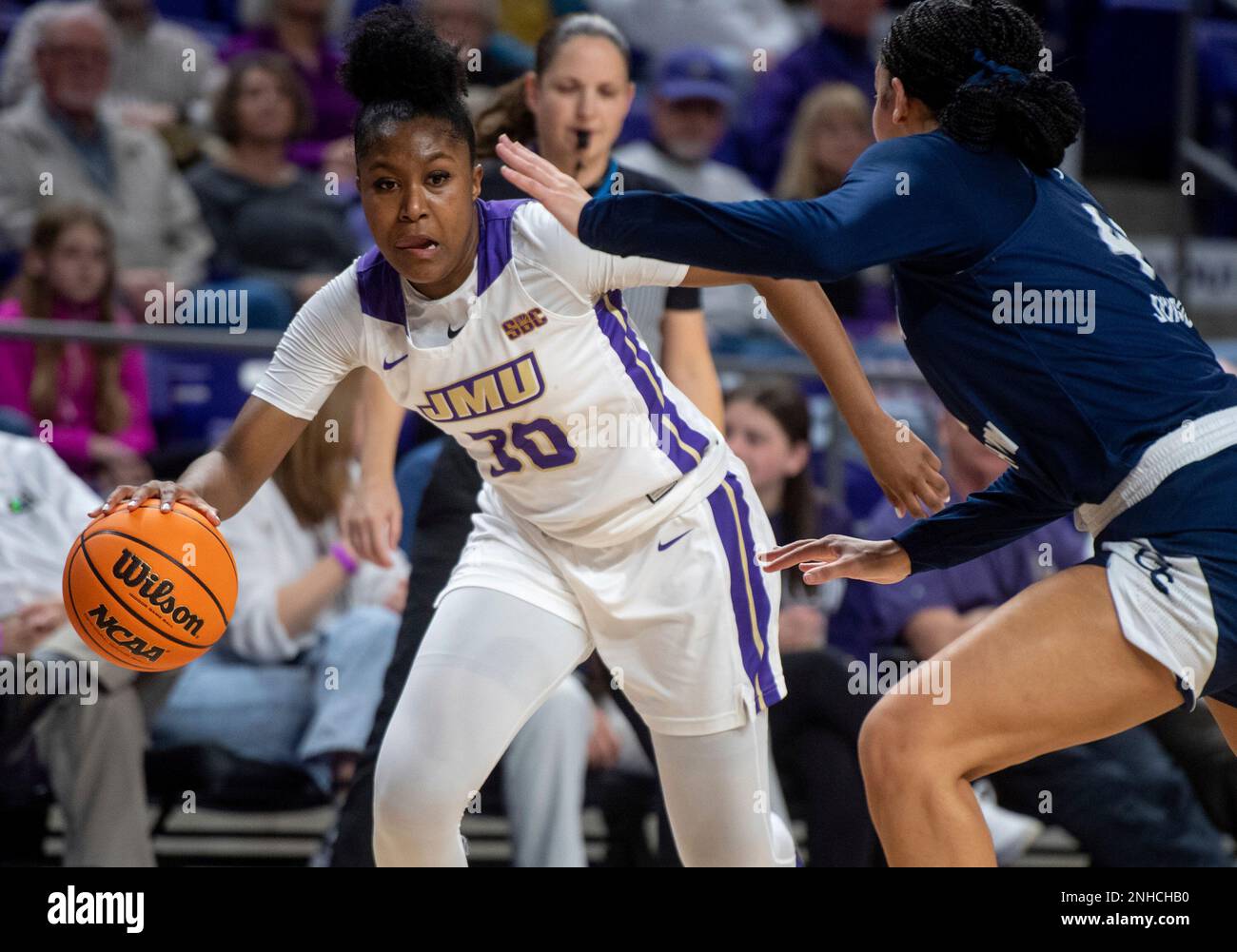 James Madison guard Kiki Jefferson (30) drives around Georgia Southern ...