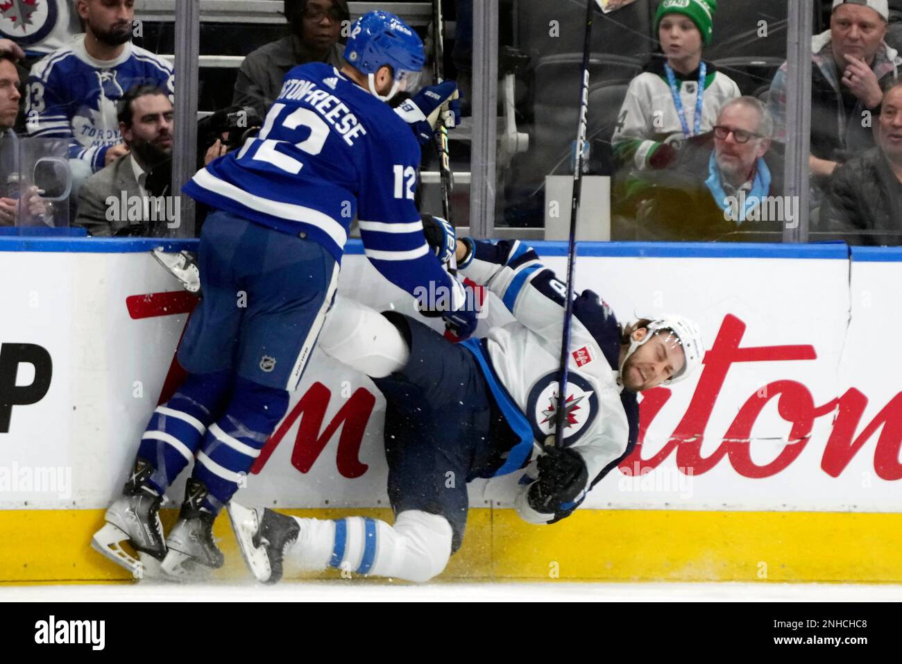 Toronto Maple Leafs center Zach Aston-Reese (12) checks Winnipeg Jets ...