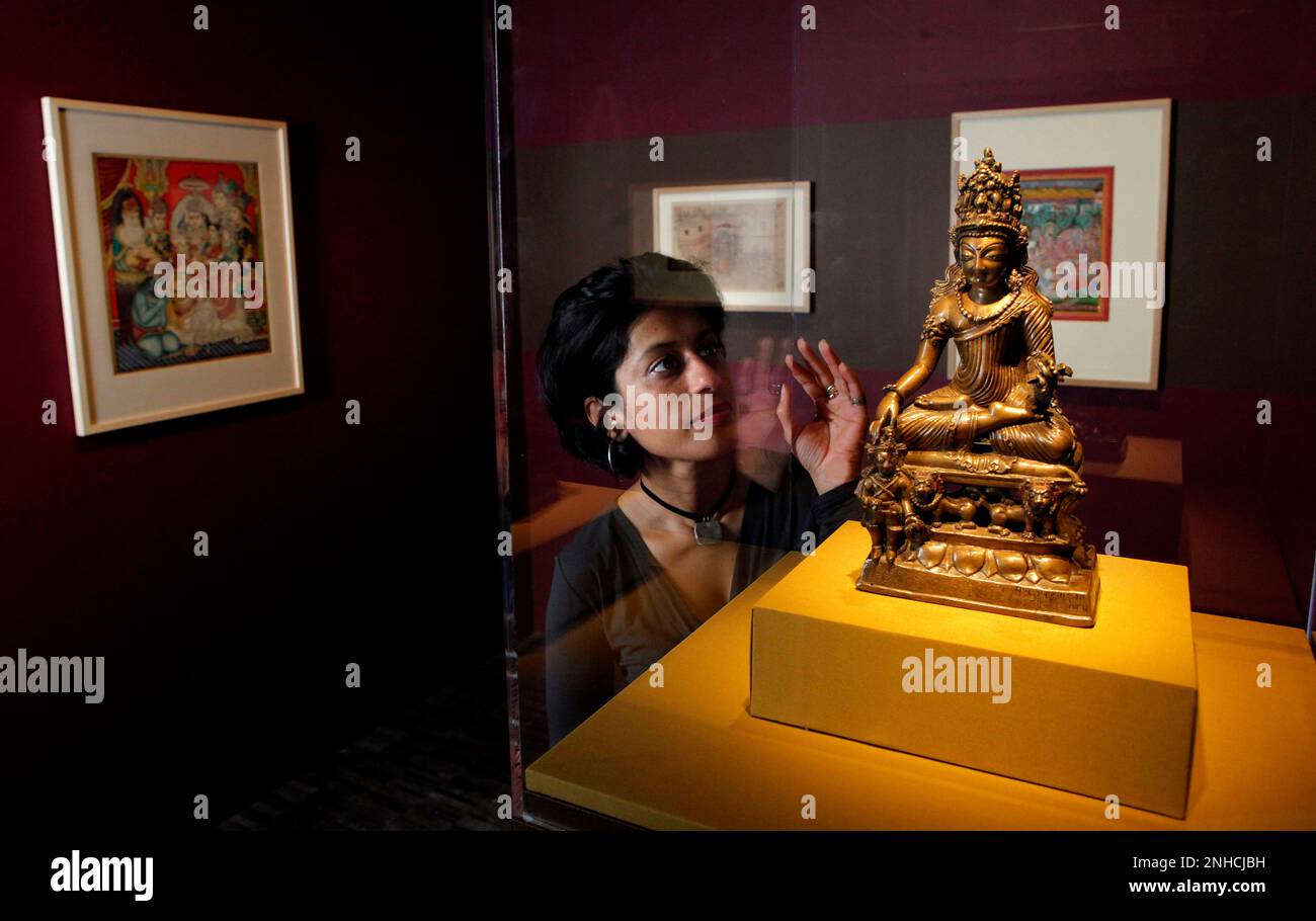 Qamar Adamjee, the Asian Art Museum's organizing curator, next to a ...