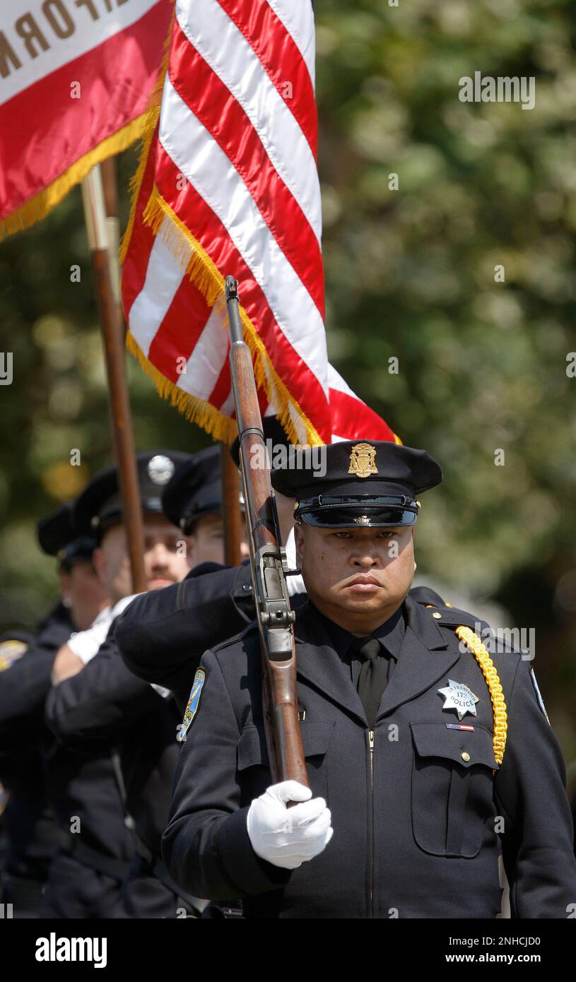 San Francisco Police Officer Roel Dilag leads the color guard as the ...