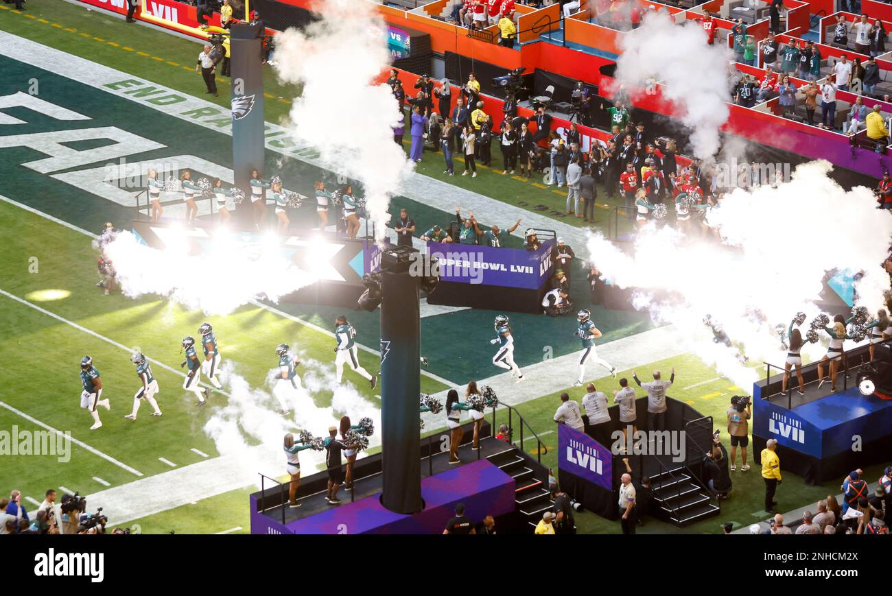 Philadelphia Eagles run onto the field before Super Bowl LVII between ...