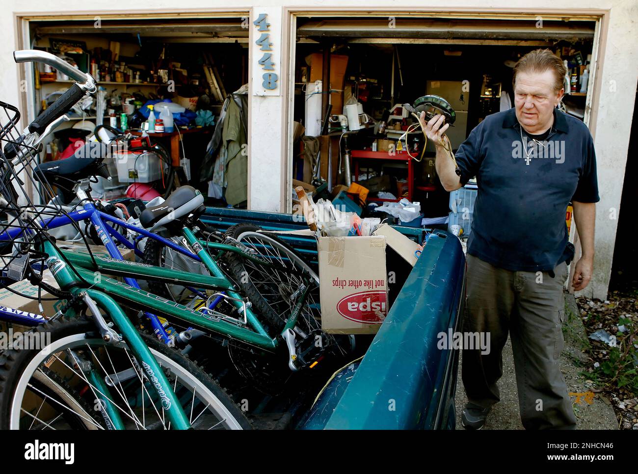 Michael Boyter loads his belongings into his pick up truck to take to ...
