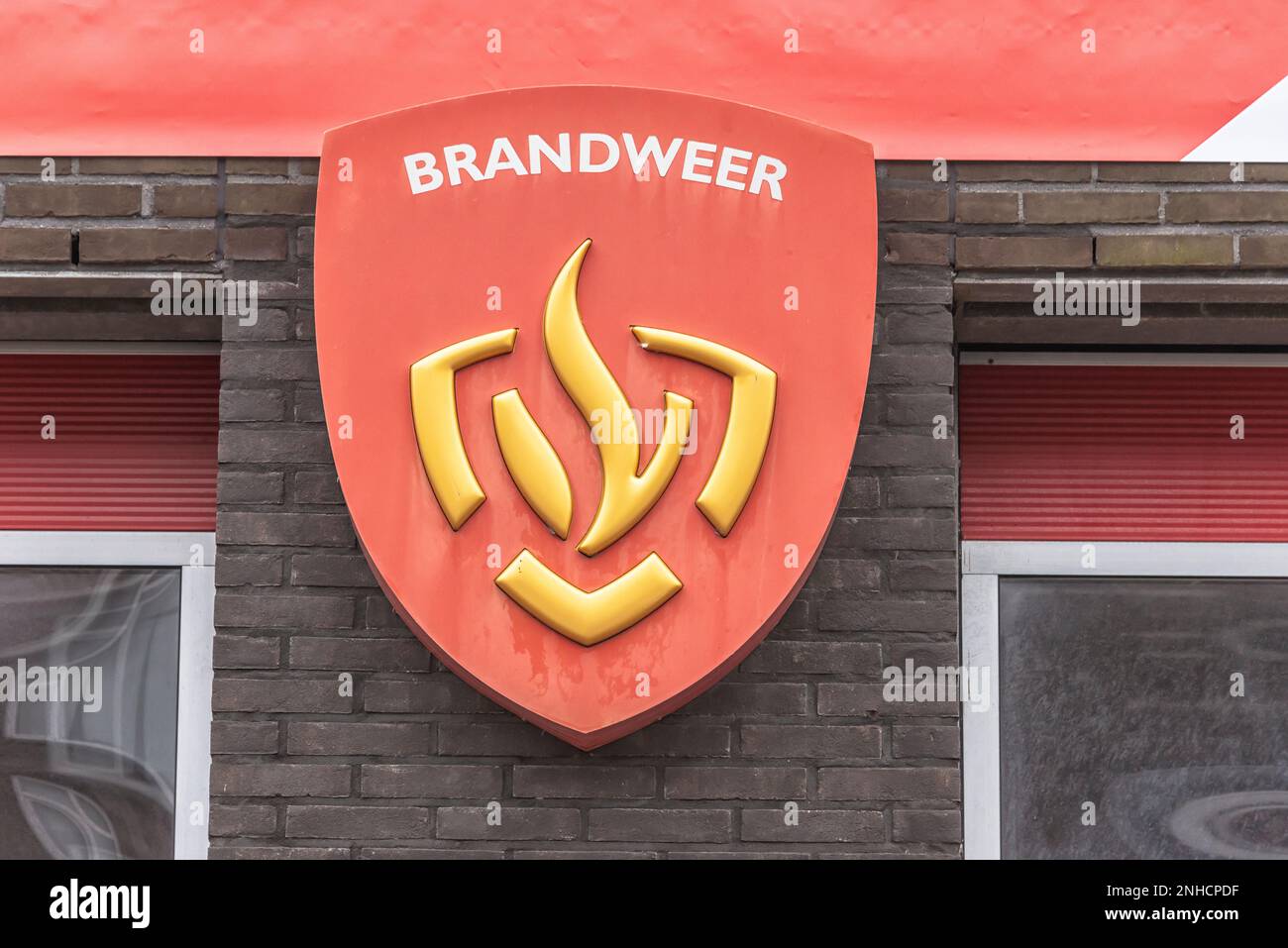 logo of the fire department on the wall of the barracks Stock Photo - Alamy