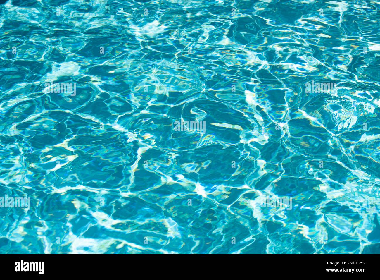 Water in swimming pool, background with high resolution. Wave abstract or rippled water texture ...