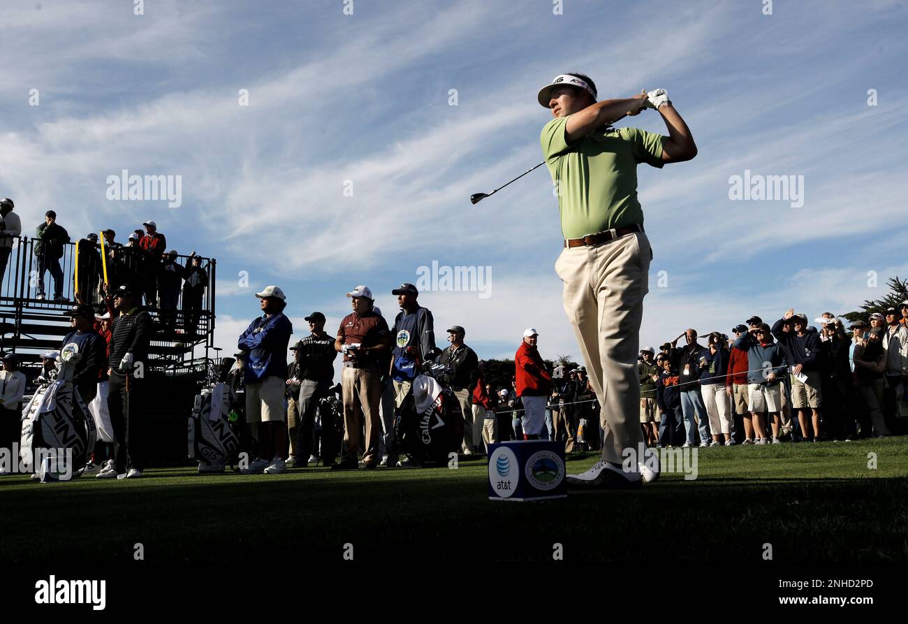 Zack Miller, who was paired with Phil Mickelson (back left), hits an ...