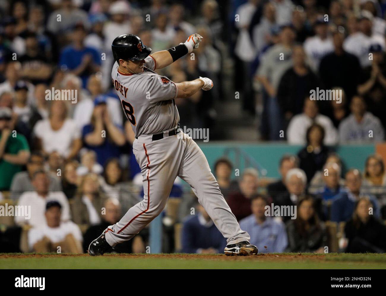With the bases loaded on a 3-2 pitch, the Giants' Buster Posey swings ...